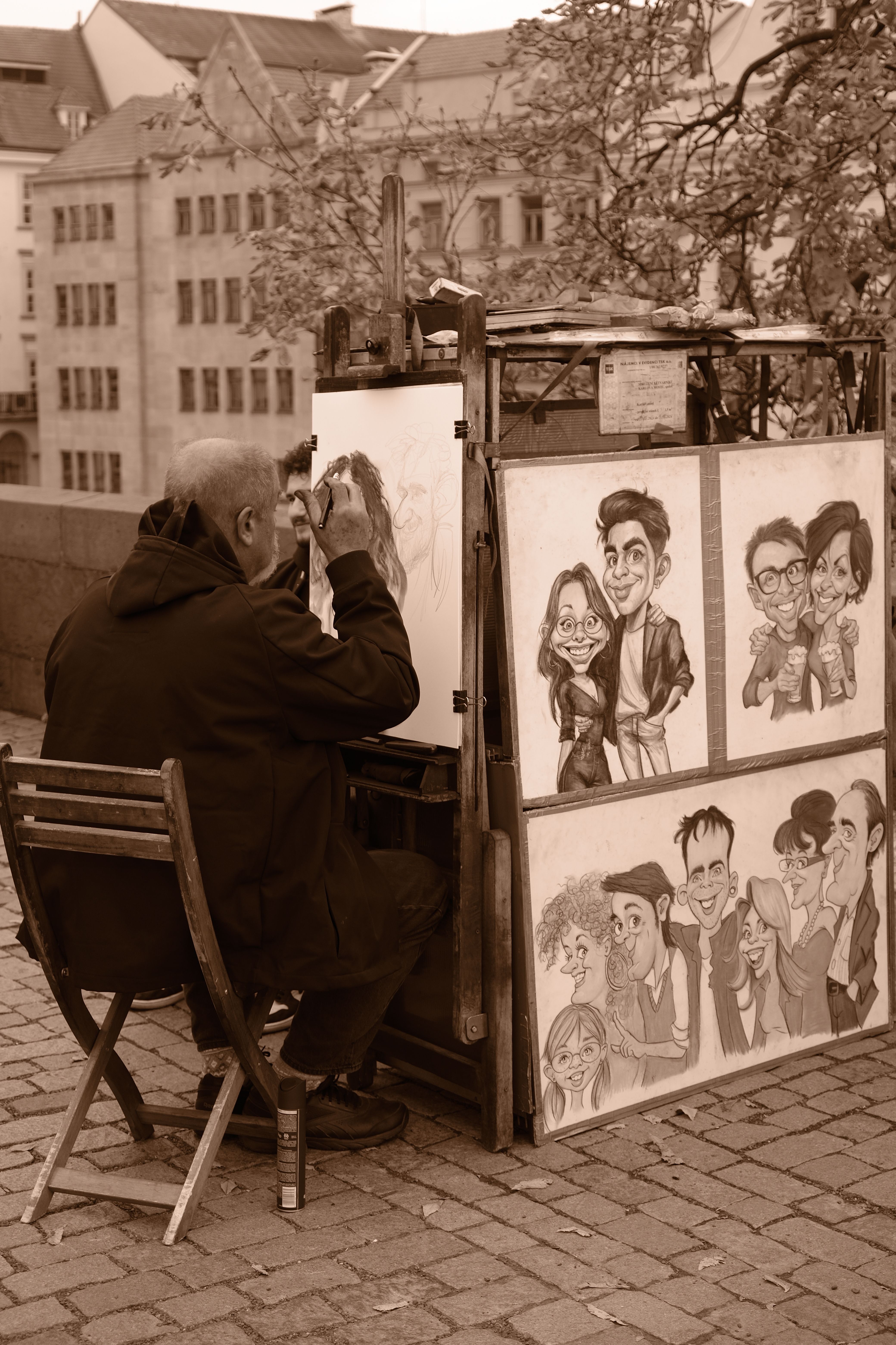 Street Artist Sketching in Prague's Old Town · Free Stock Photo