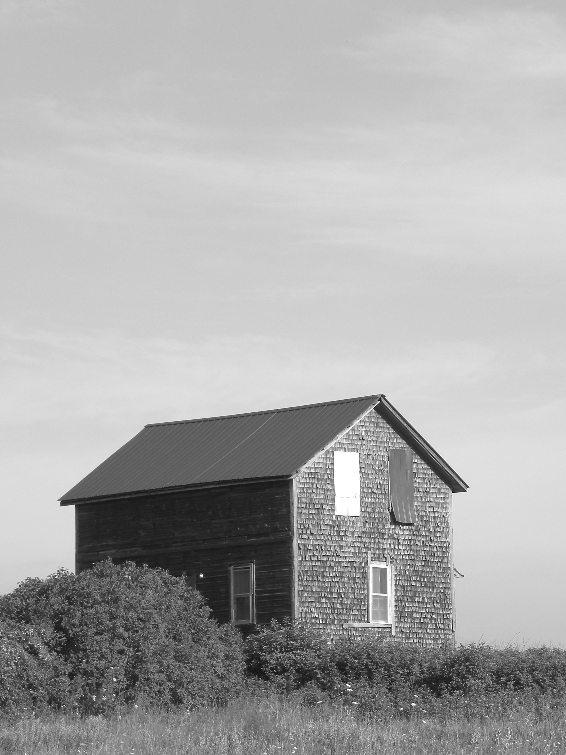 Isolated Rustic Cabin in Open Field Landscape · Free Stock Photo