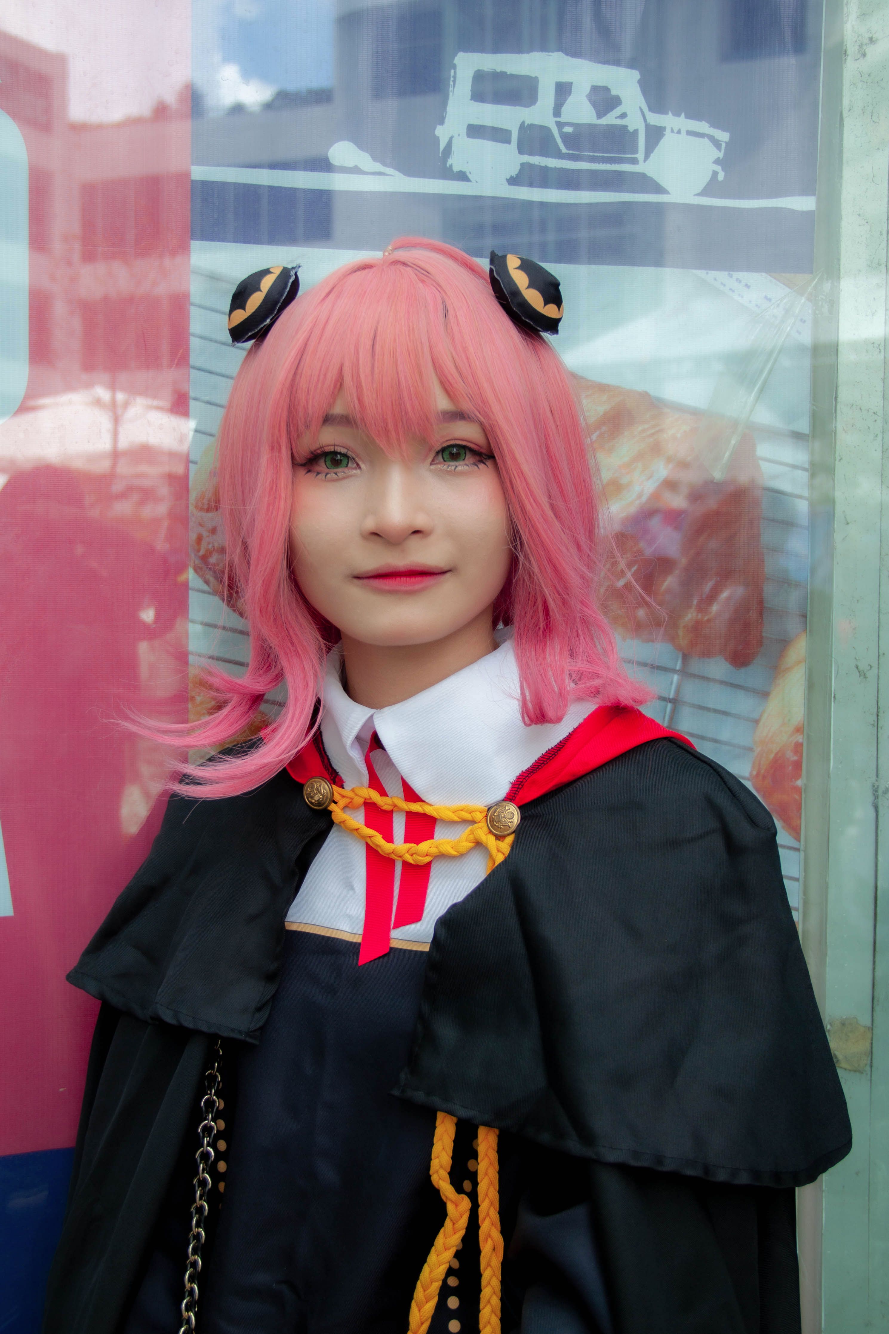 Cosplay Character with Pink Hair and Cape · Free Stock Photo