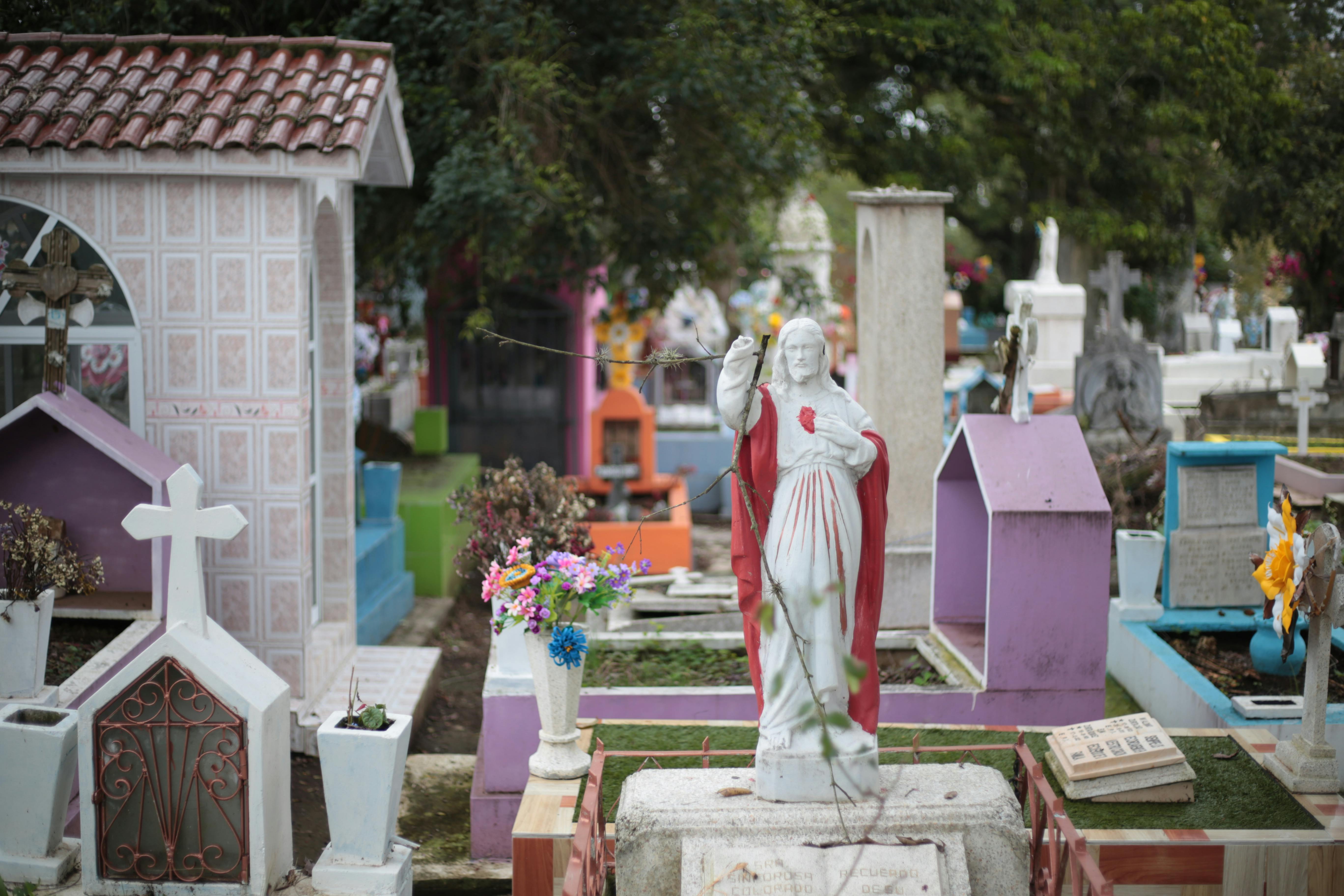 Colorful Cemetery with Religious Statue · Free Stock Photo
