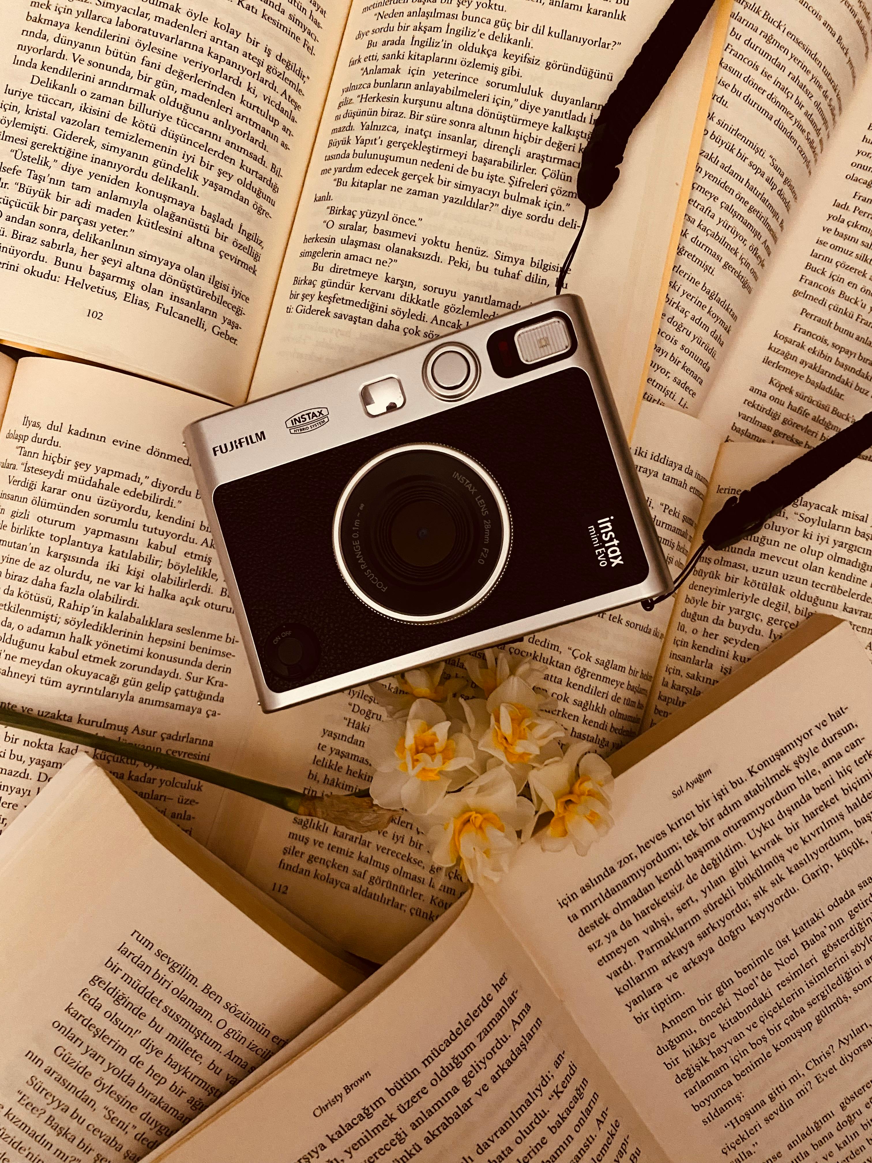 Vintage Camera on Open Books with Flowers · Free Stock Photo