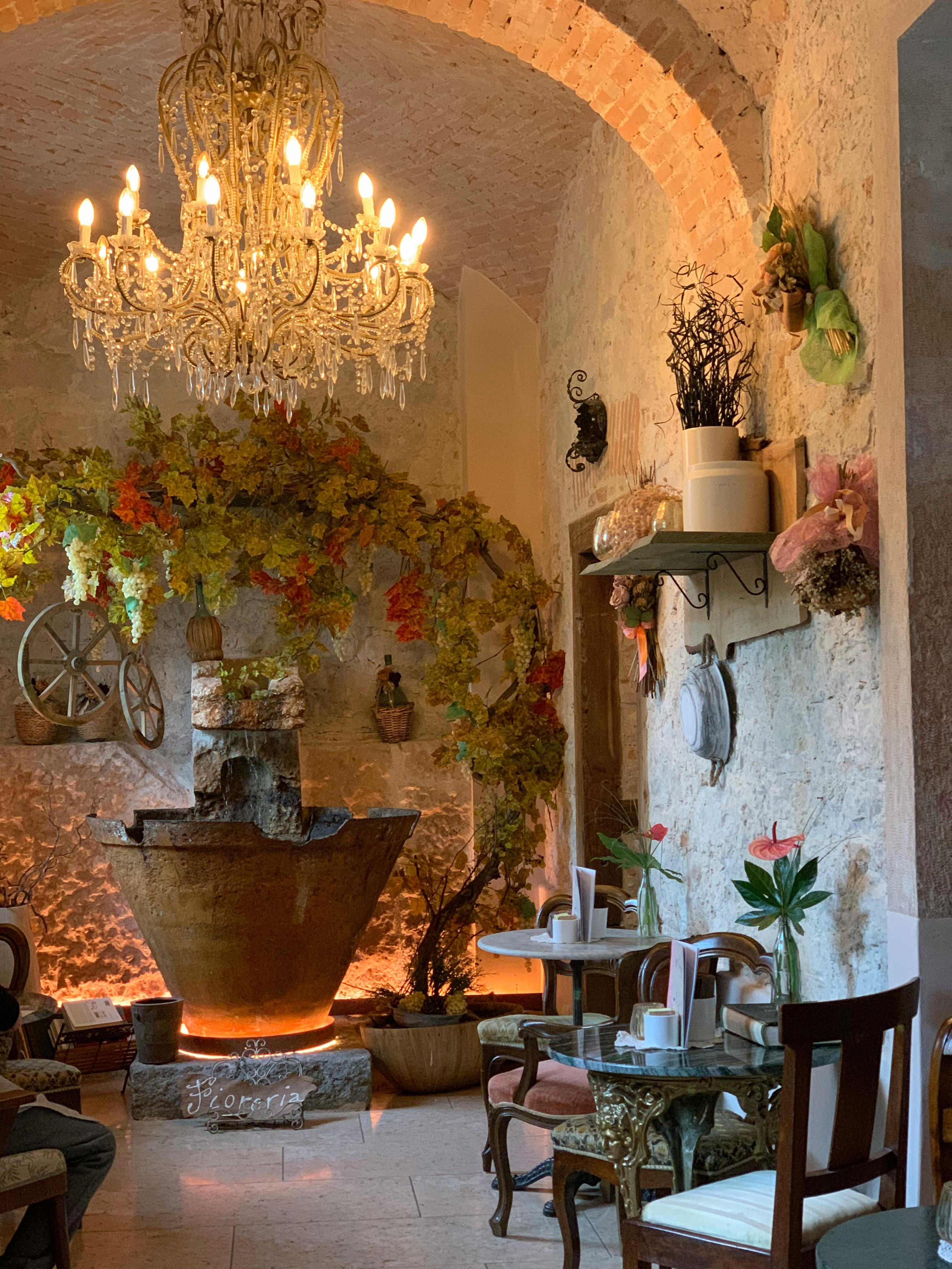 Elegant Rustic Café Interior with Chandelier · Free Stock Photo