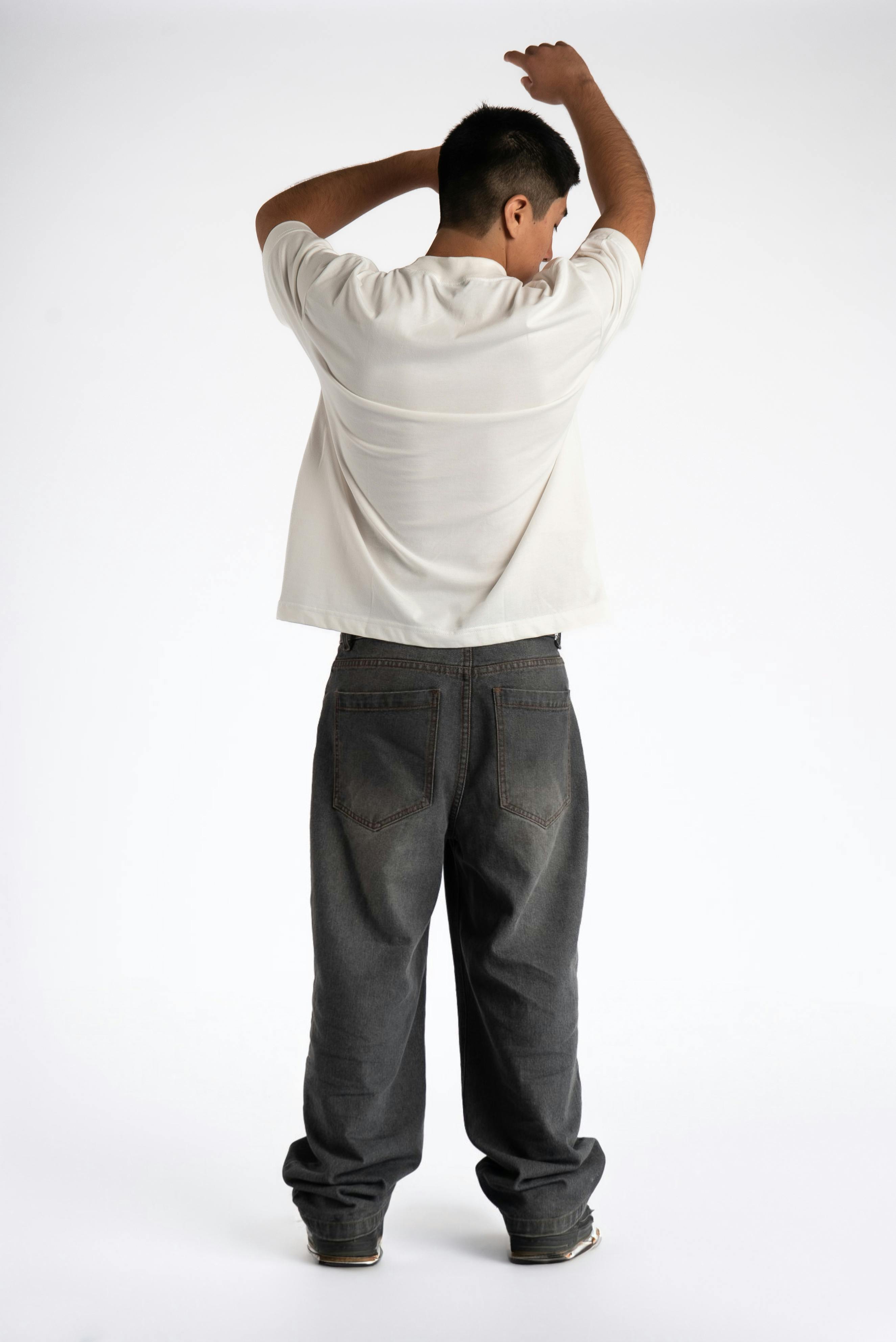 Casual Teen Modeling White Shirt and Jeans · Free Stock Photo