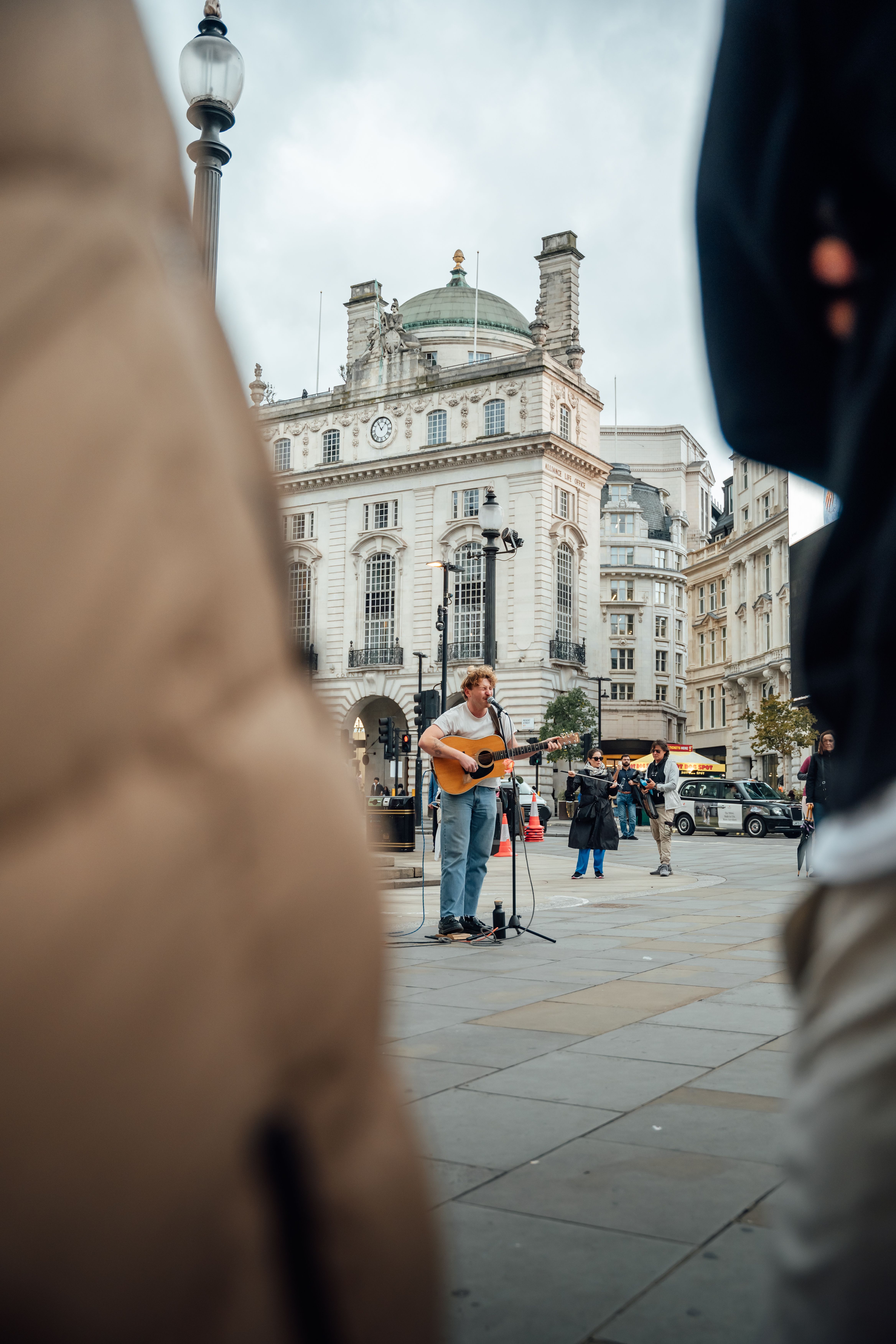 Street Musician Performing in London's Piccadilly Circus · Free Stock Photo