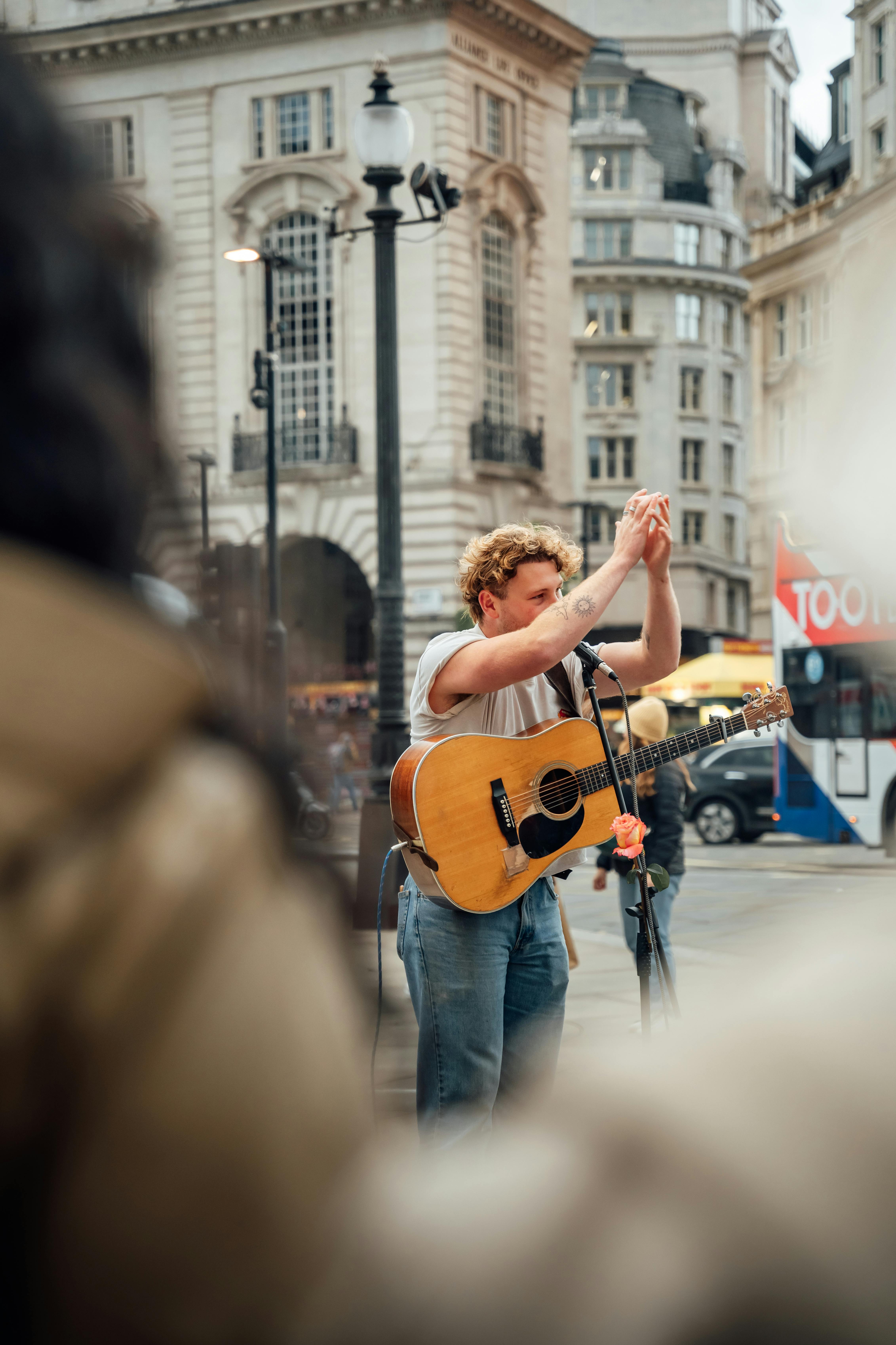 Street Musician Performing in Busy London Square · Free Stock Photo