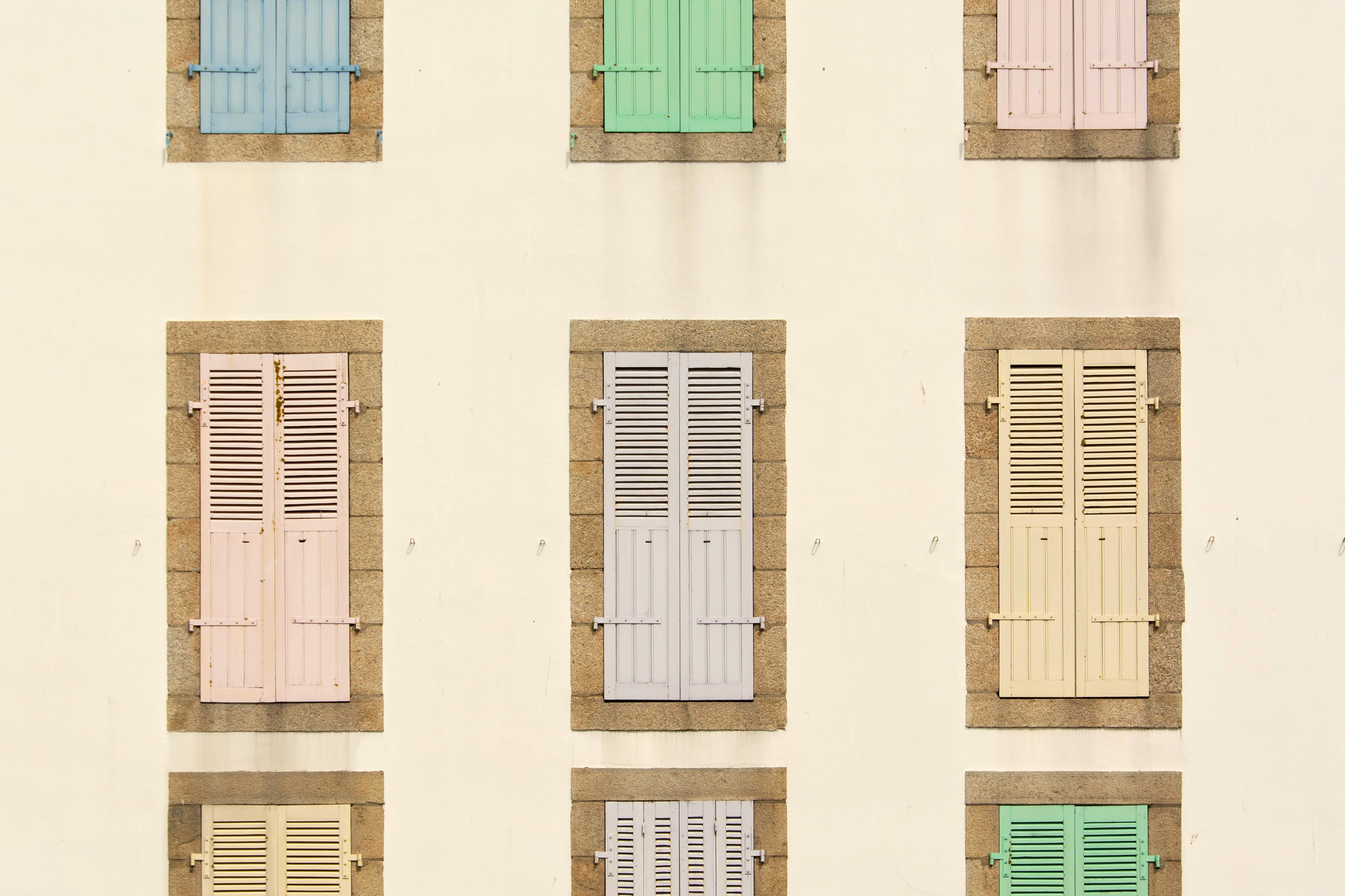 Colorful Shuttered Windows on Building Facade · Free Stock Photo
