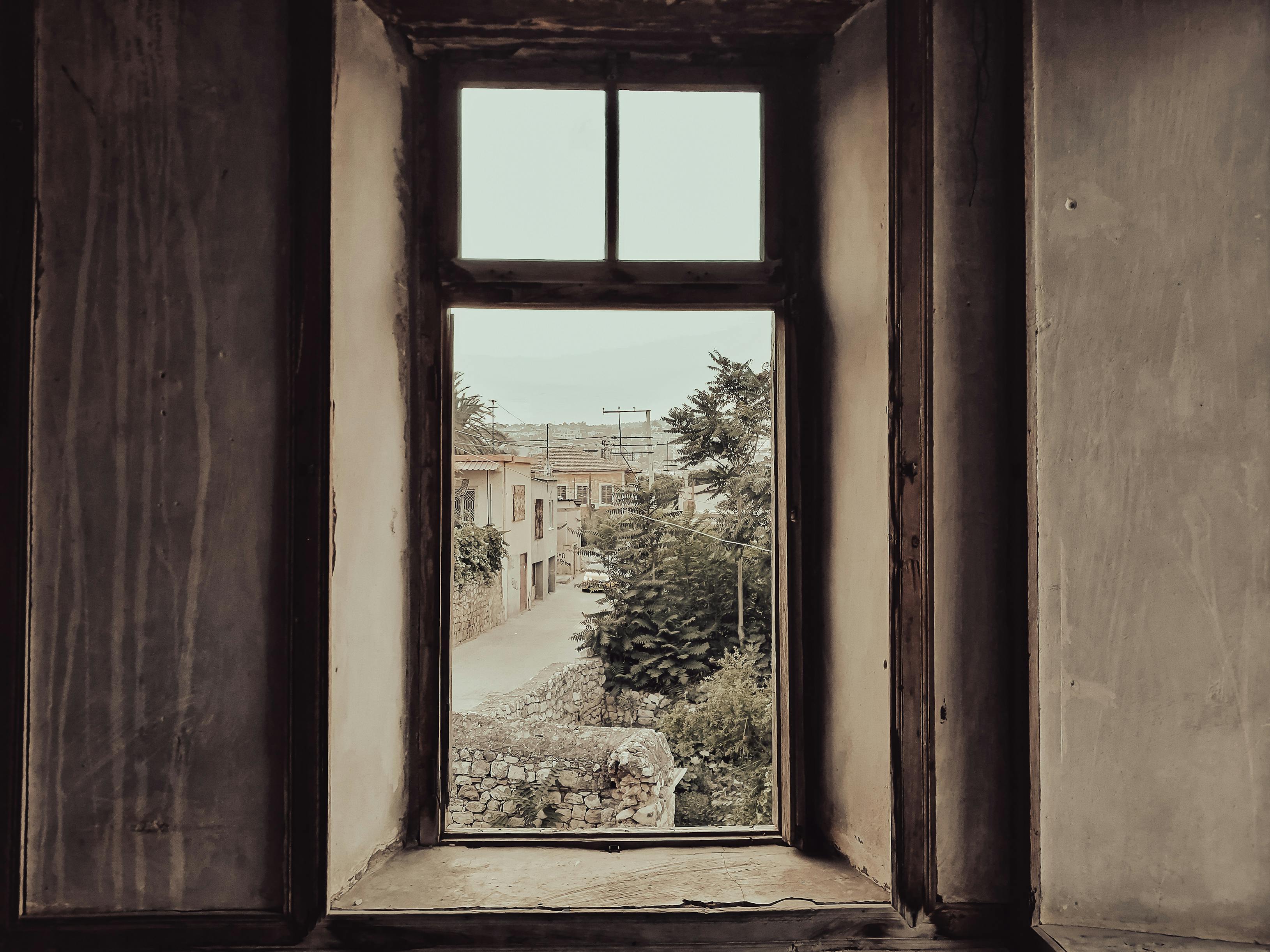 Scenic View Through an Old Rustic Window · Free Stock Photo