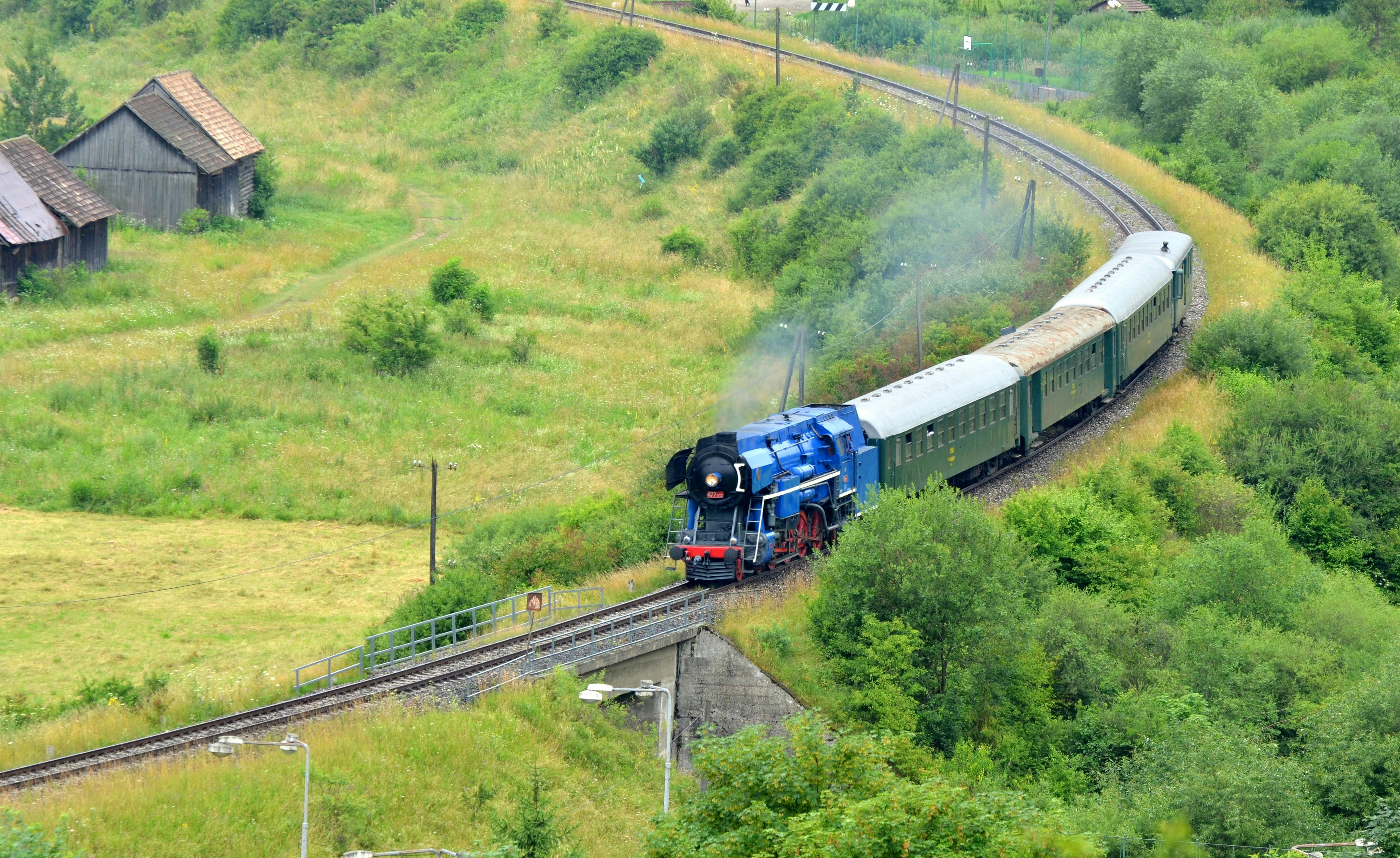 Vintage Blue Train in Lush Slovak Countryside · Free Stock Photo