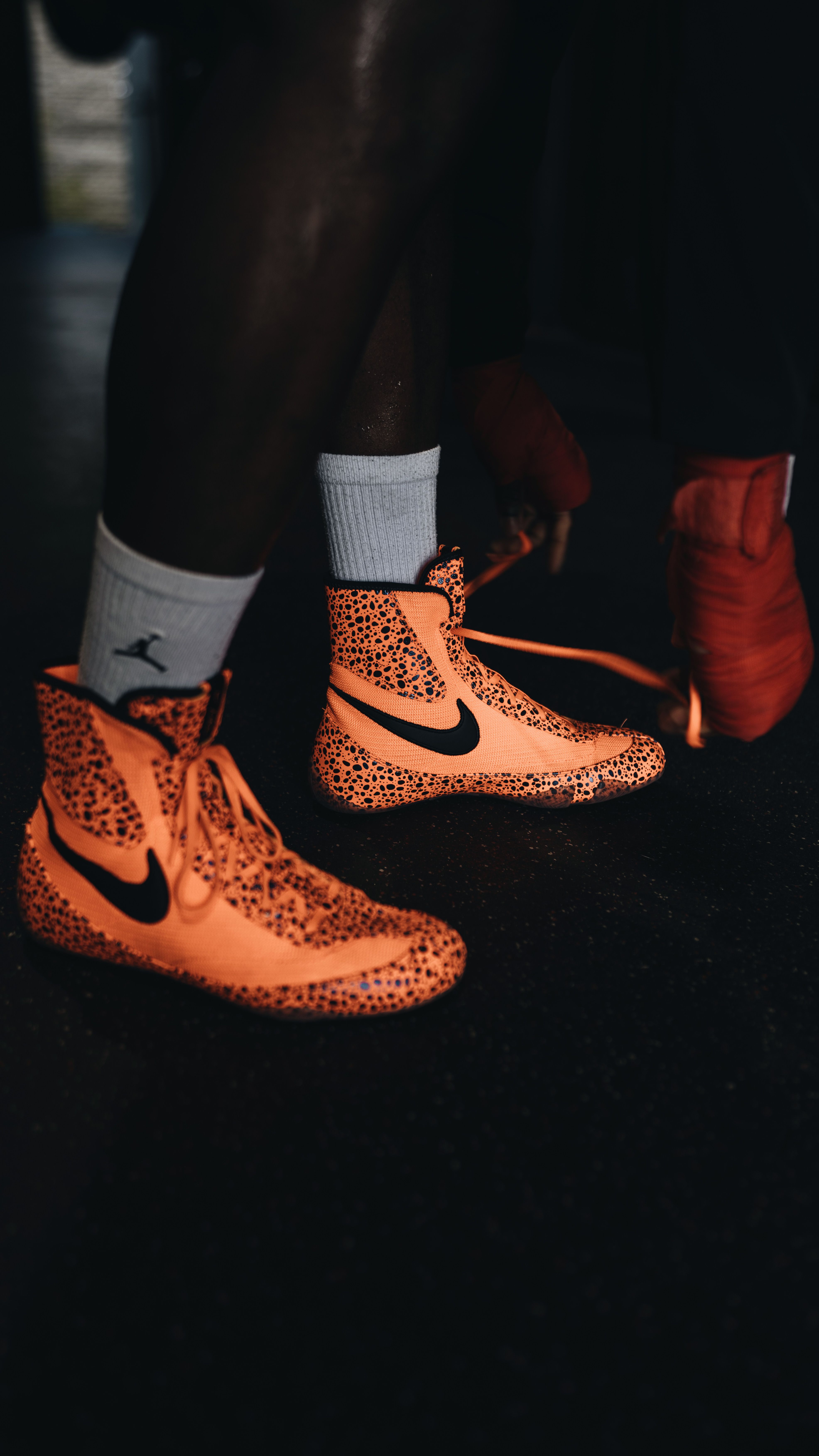 Vibrant Orange Boxing Shoes in Action · Free Stock Photo