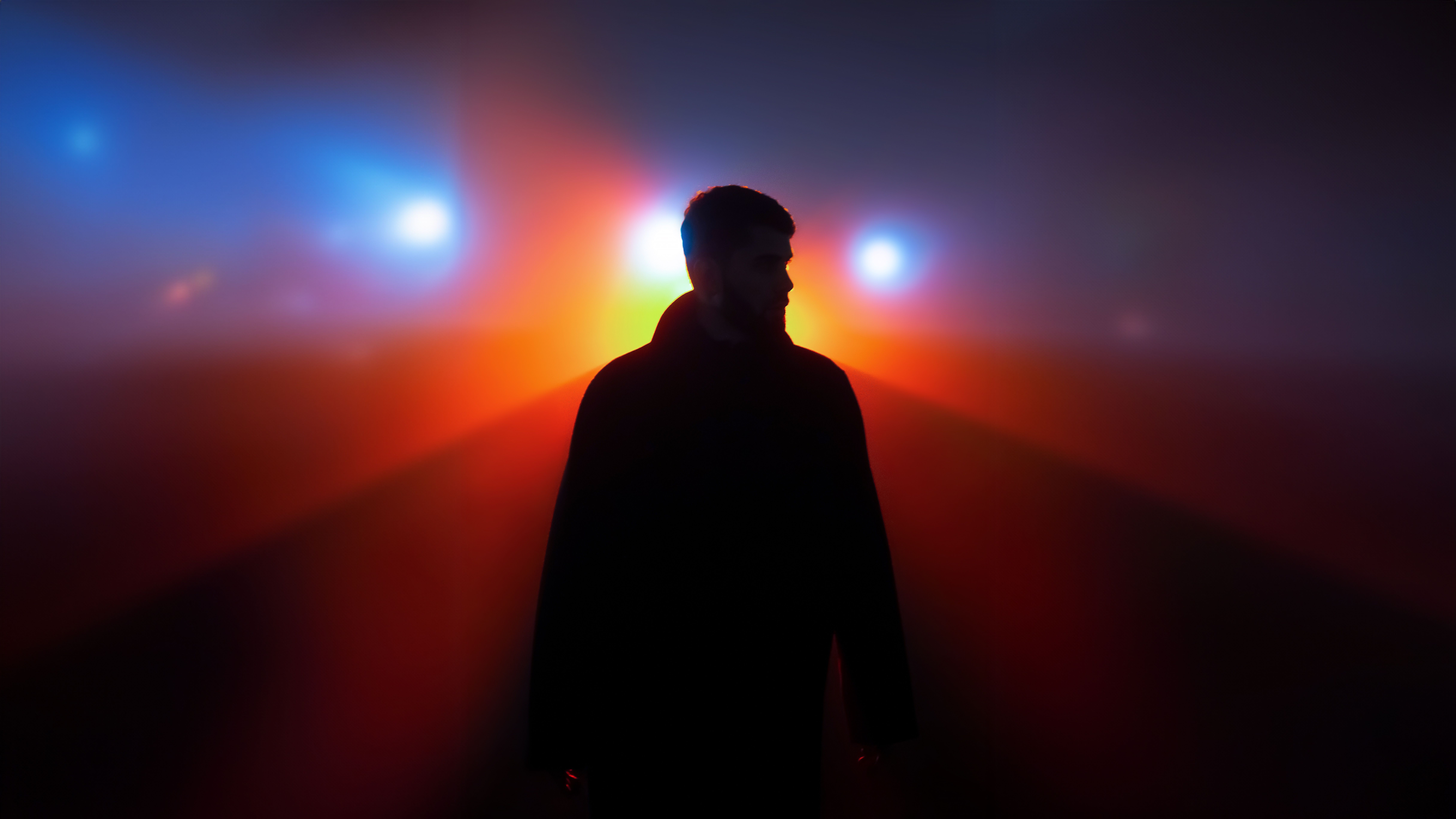 Silhouette of a Man Against Vibrant Light Background · Free Stock Photo