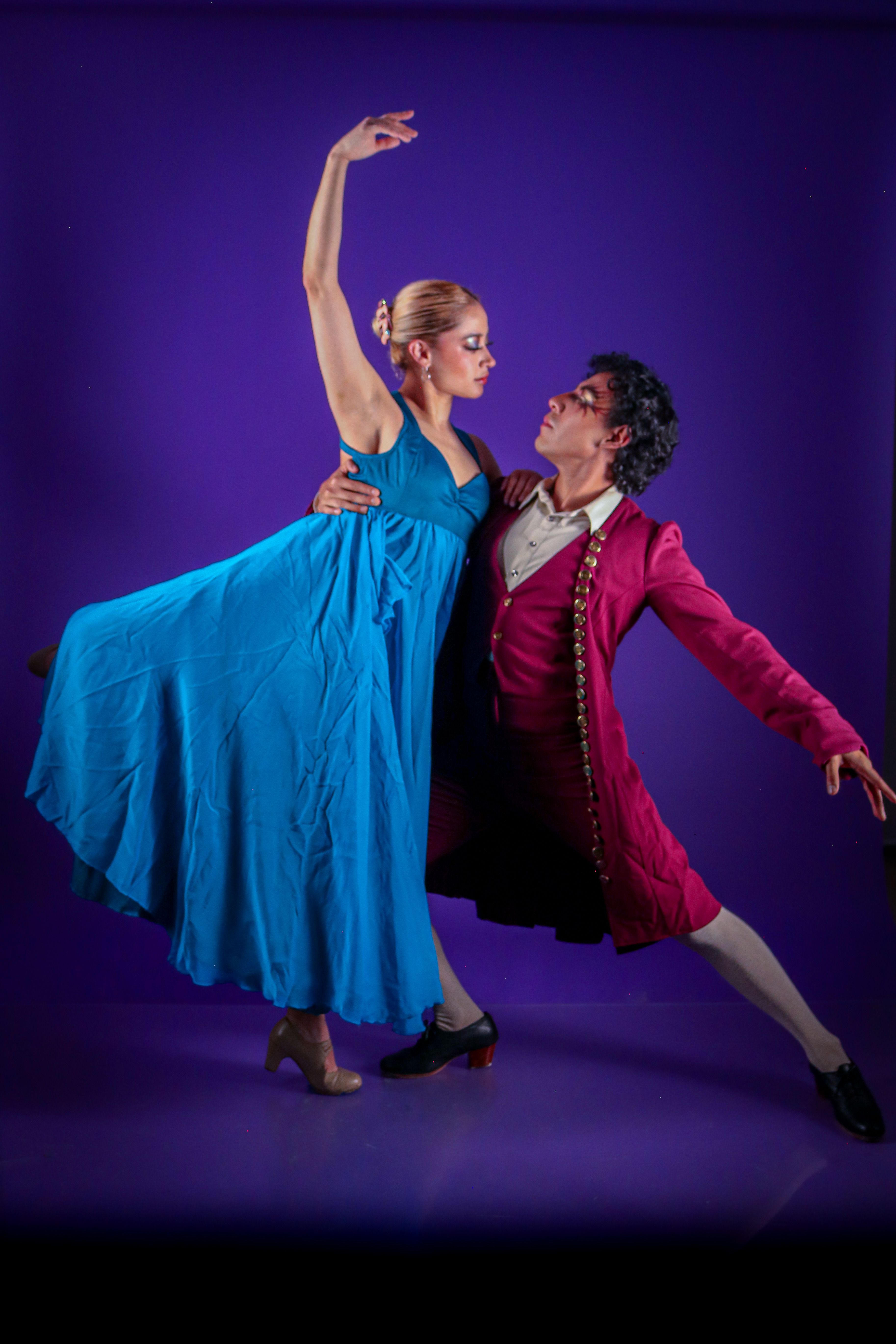 Elegant Ballet Dance Pose with Colorful Costumes · Free Stock Photo