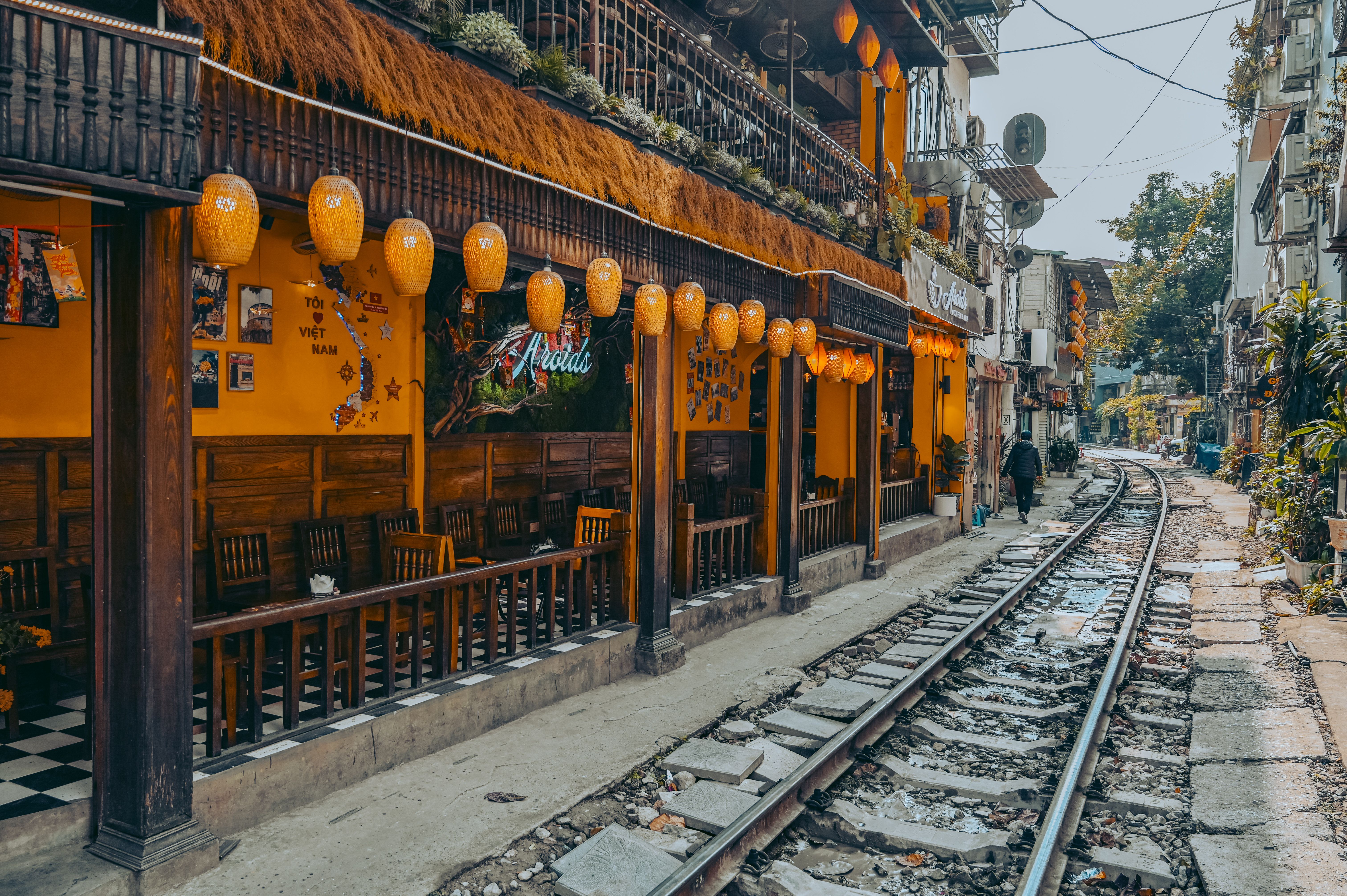 Charming Vietnamese Cafe Alongside Railway · Free Stock Photo