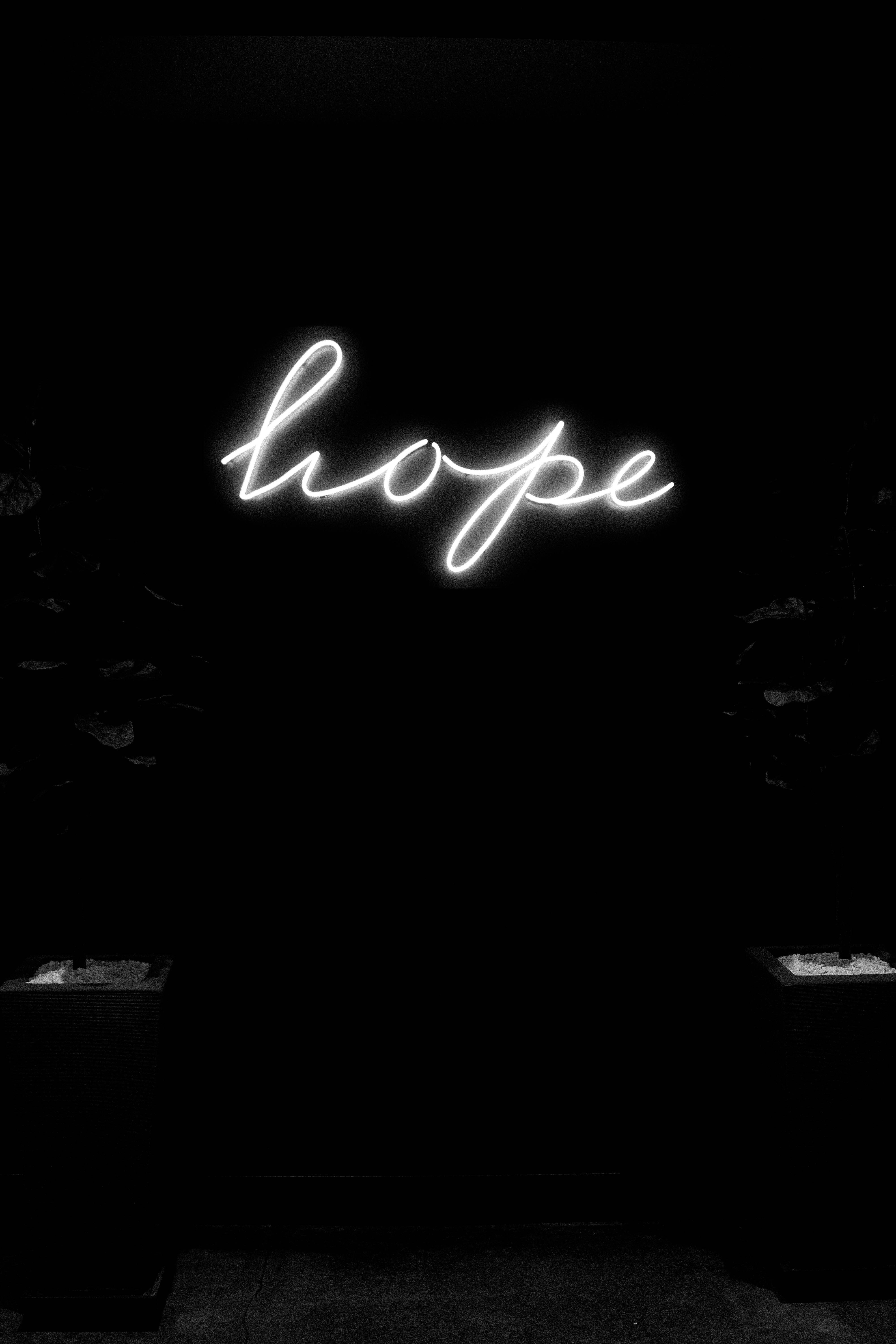 Neon Hope Sign Illuminating Dark Space · Free Stock Photo
