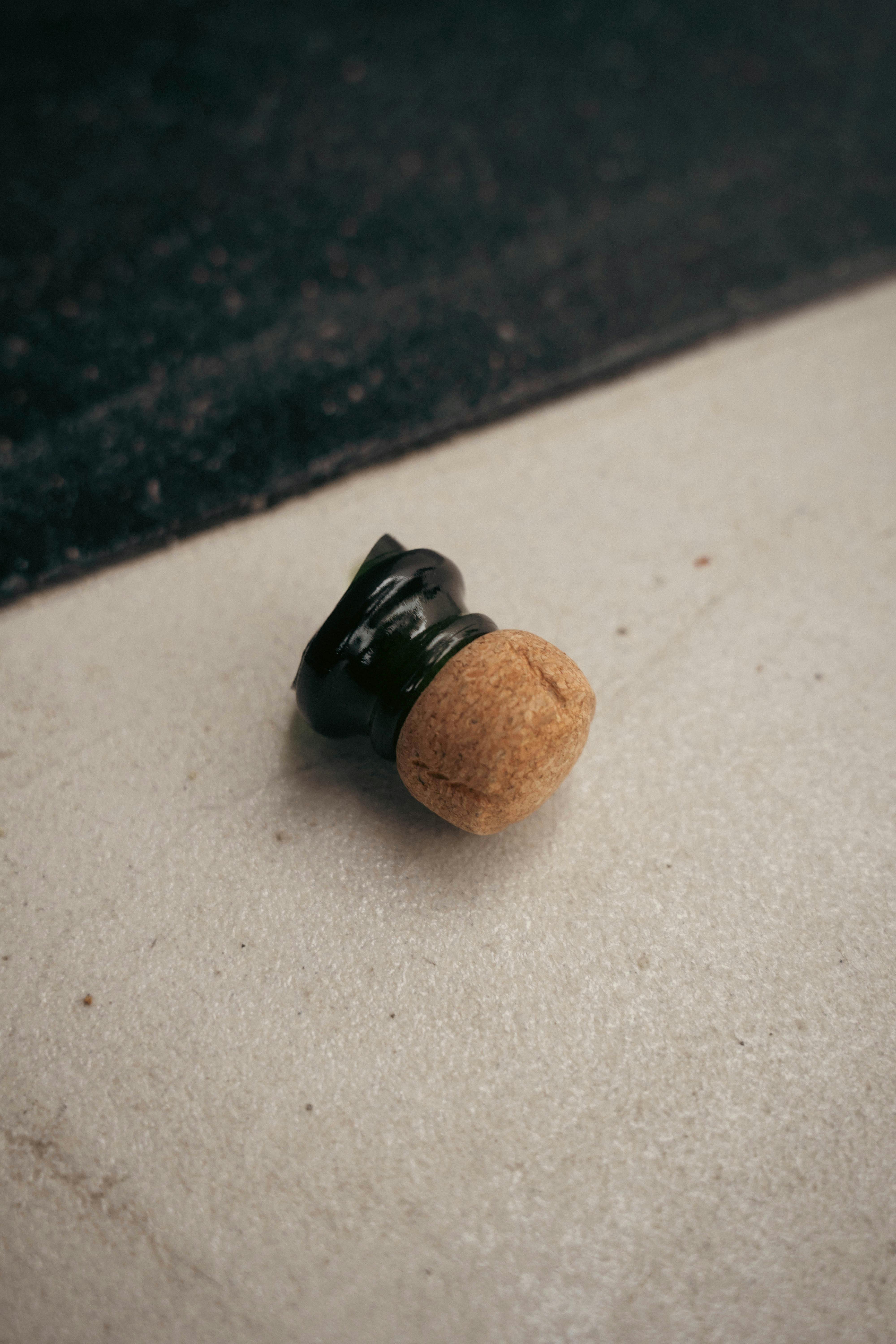 Champagne Cork on a Two-Tone Surface · Free Stock Photo