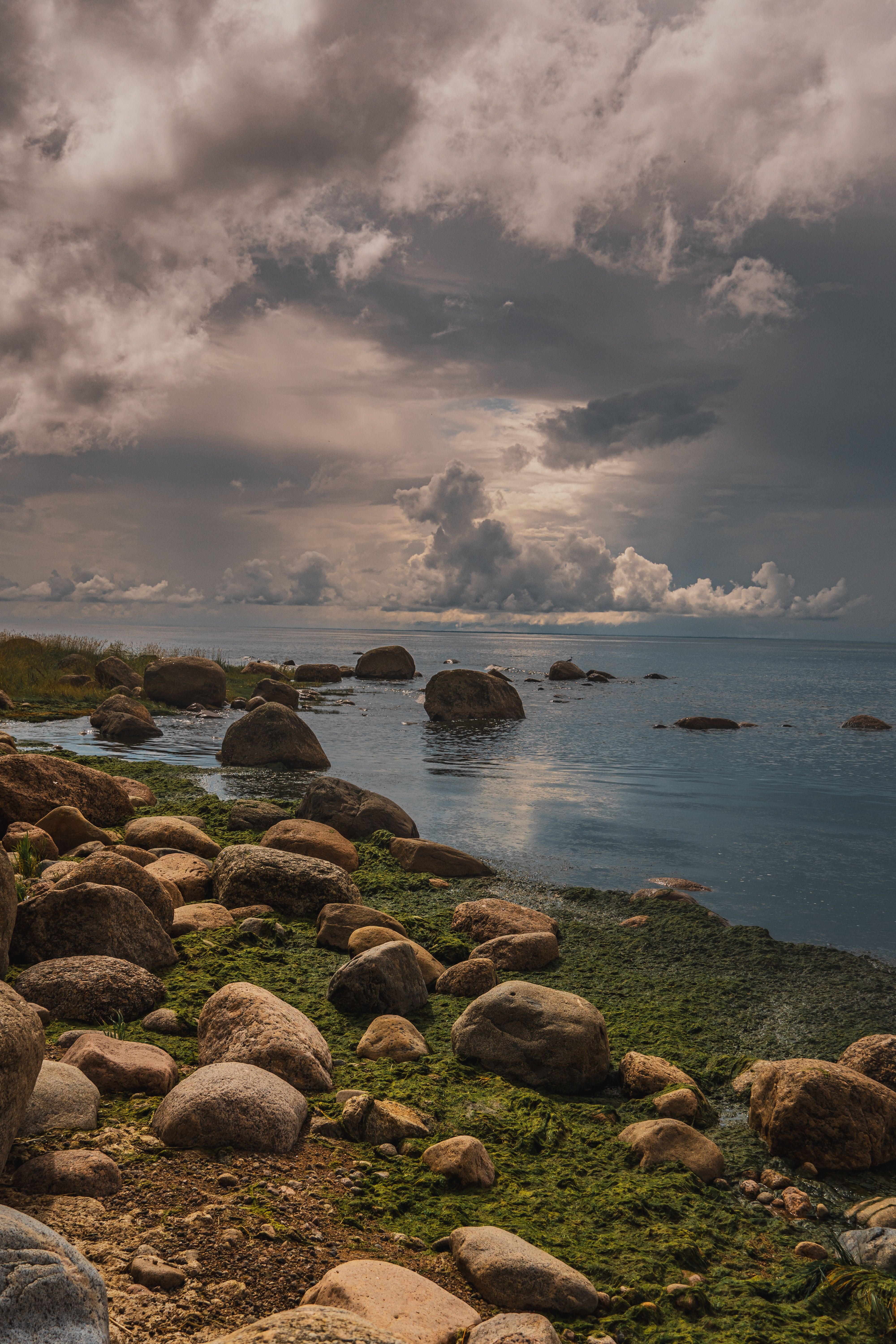 Dramatic Seaside Landscape with Rocky Shoreline · Free Stock Photo