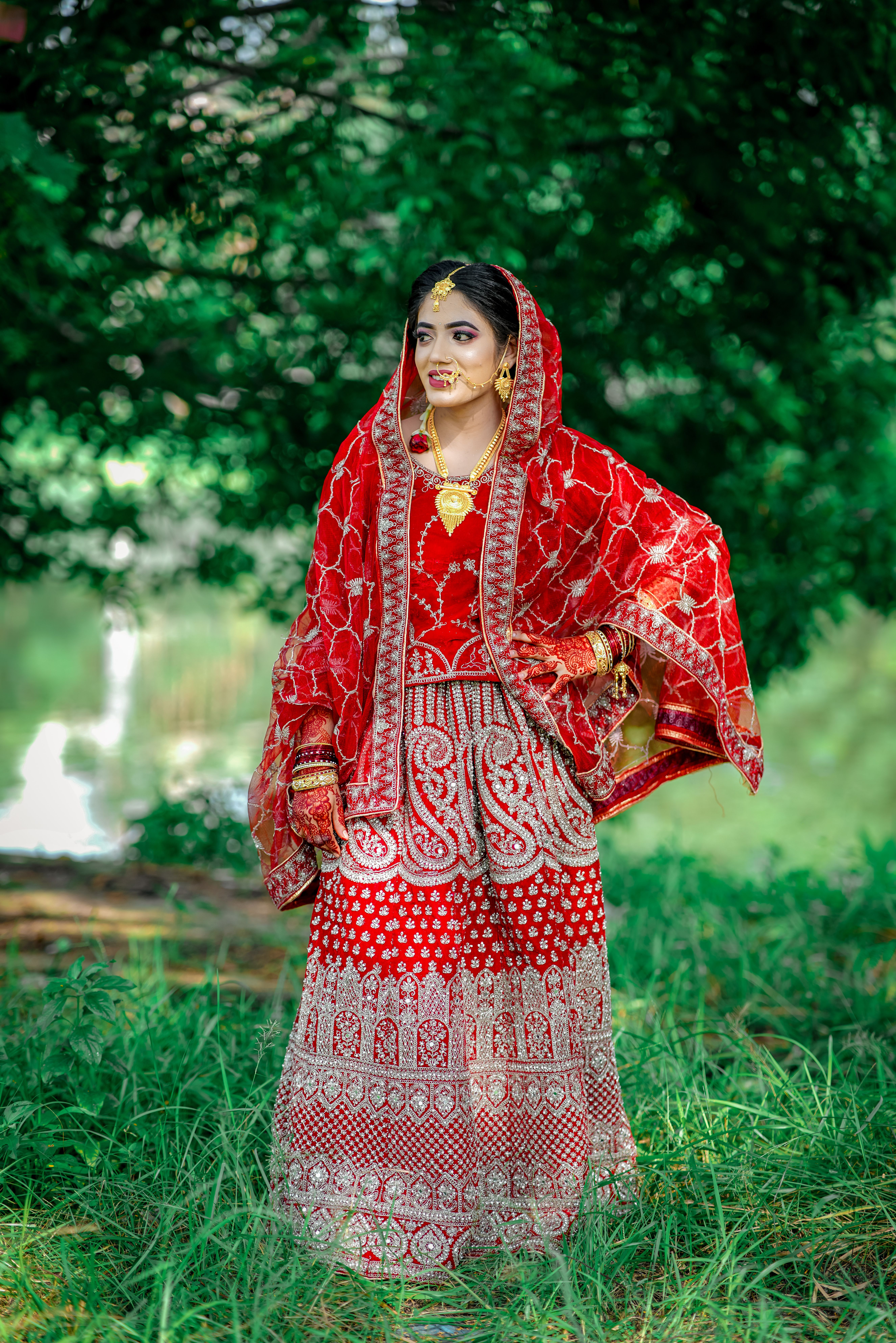 Elegant Bride in Traditional Red Bridal Attire · Free Stock Photo