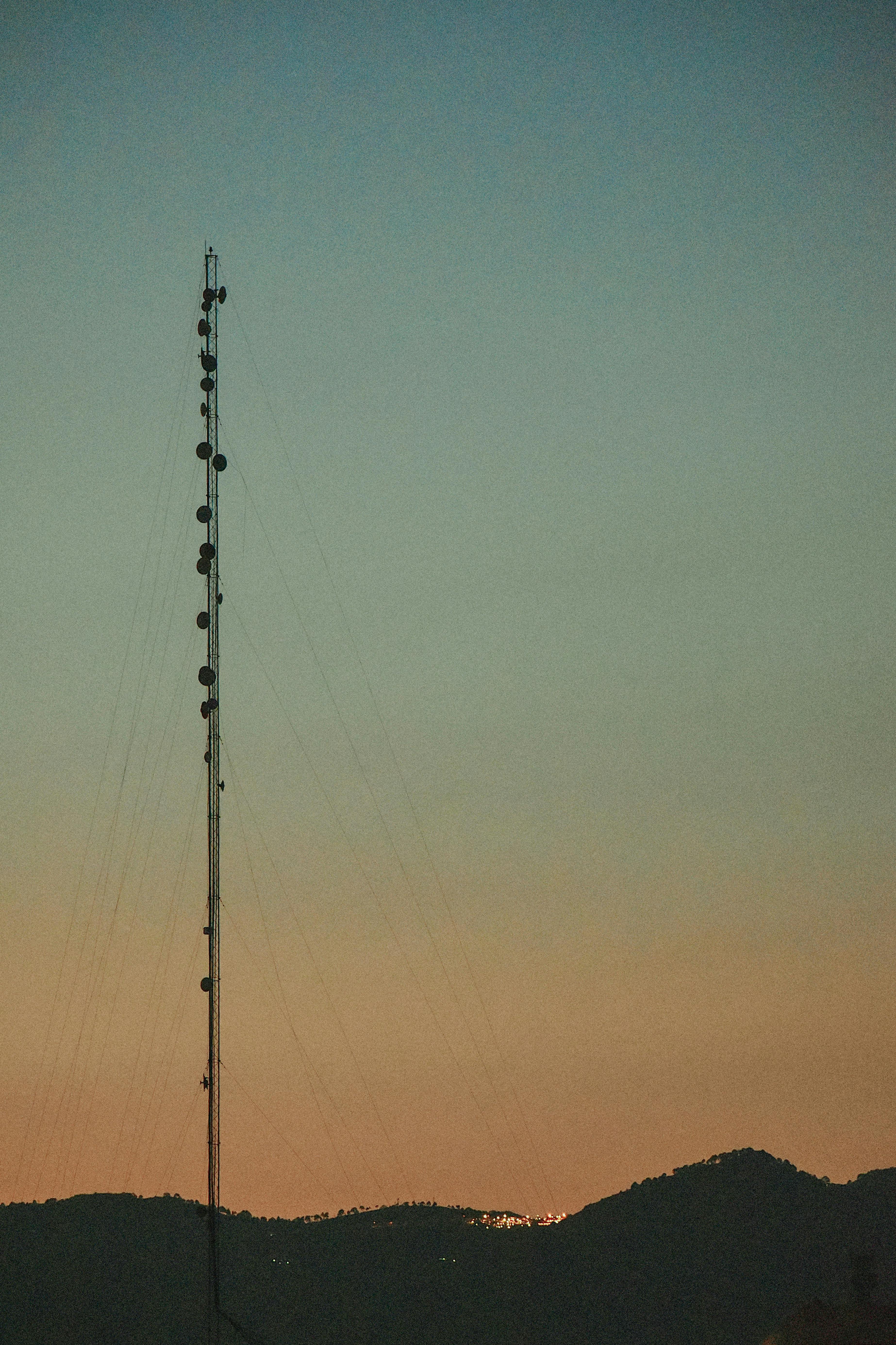 Tall Antenna Tower Against Twilight Sky · Free Stock Photo