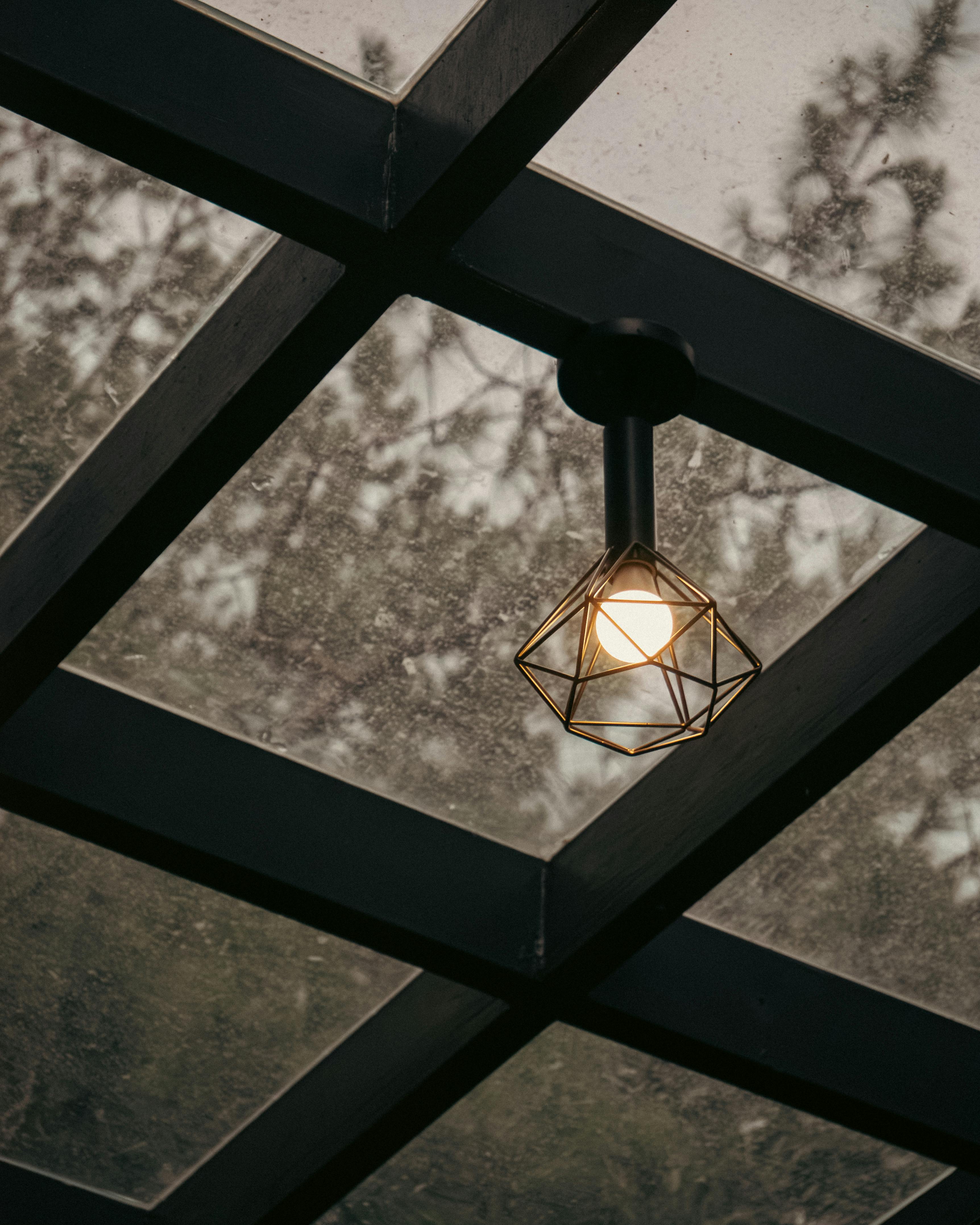 Moody Light Through Geometric Glass Ceiling · Free Stock Photo
