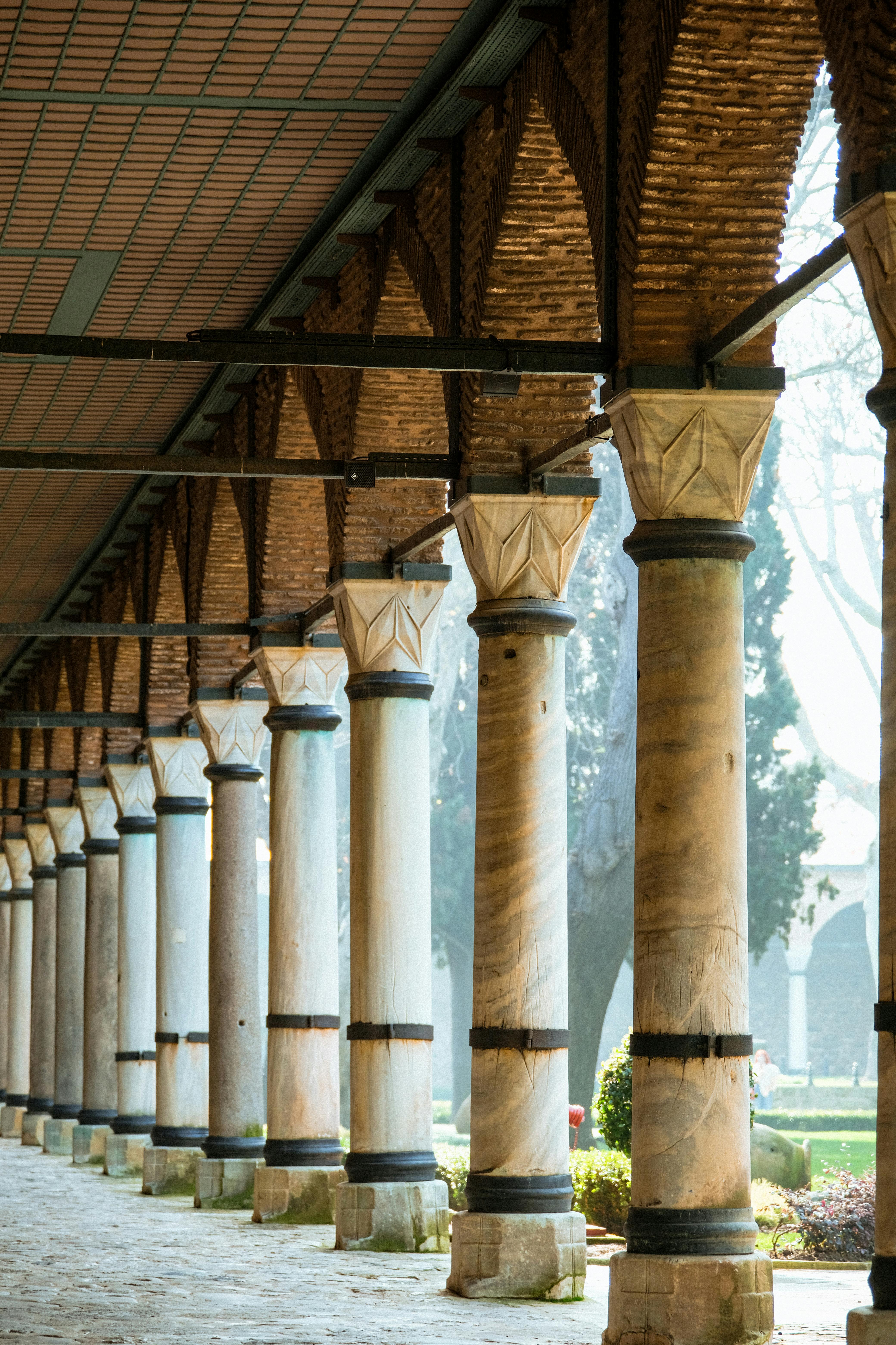 Historic Stone Colonnade with Ornate Columns · Free Stock Photo