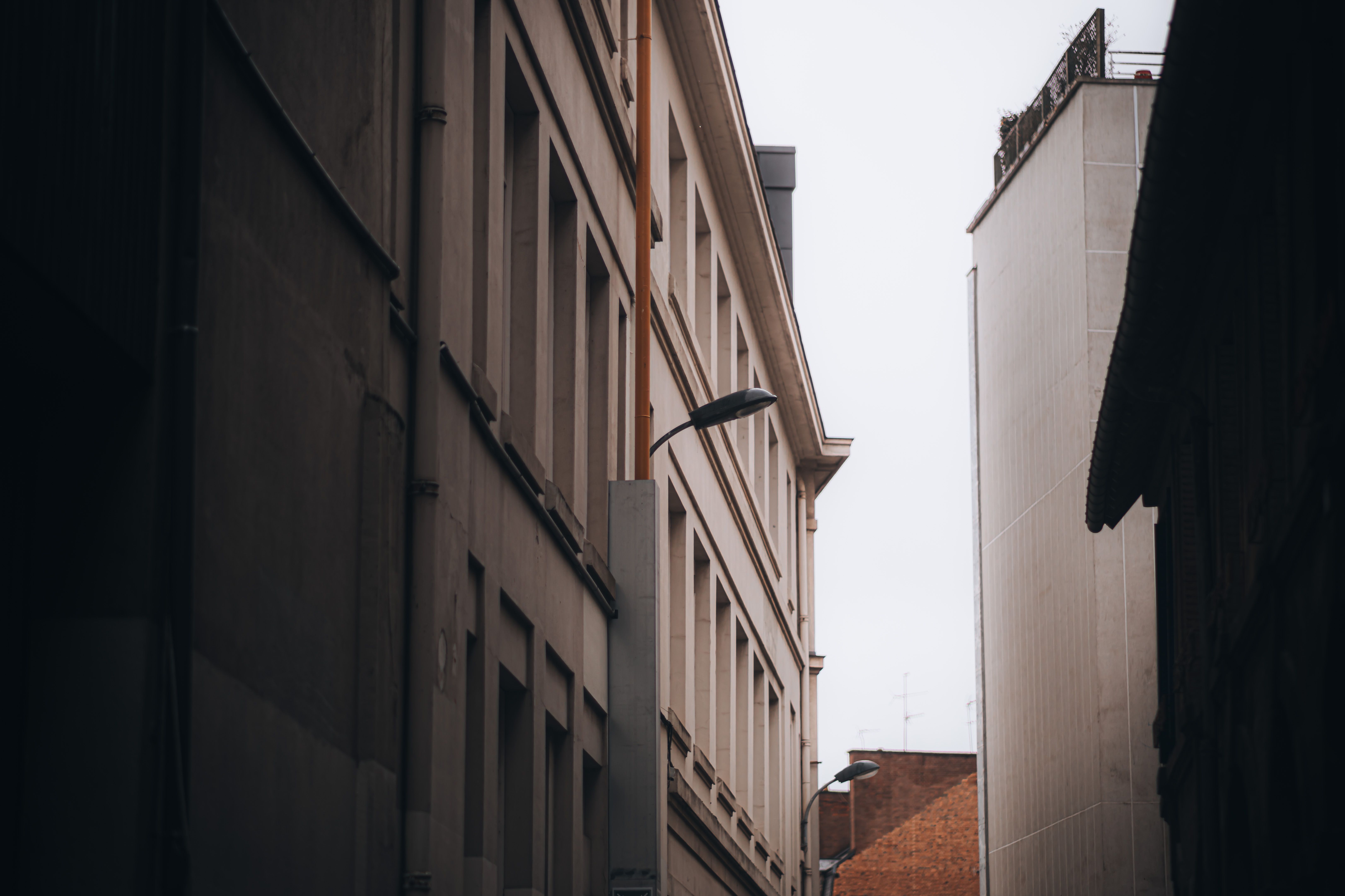 Narrow Urban Alley with Modern Buildings · Free Stock Photo