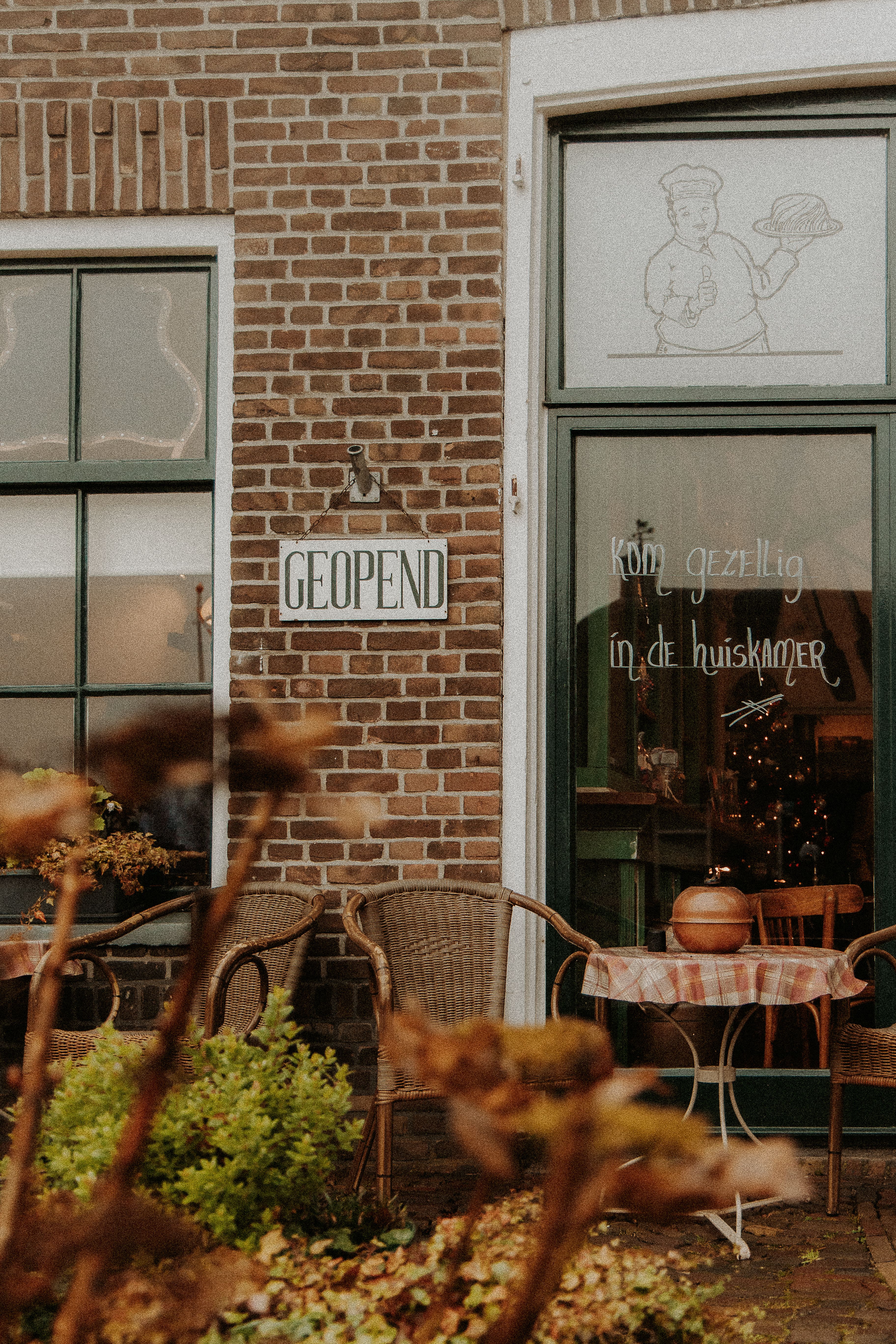 Charming Dutch Cafe Exterior with Holiday Decor · Free Stock Photo