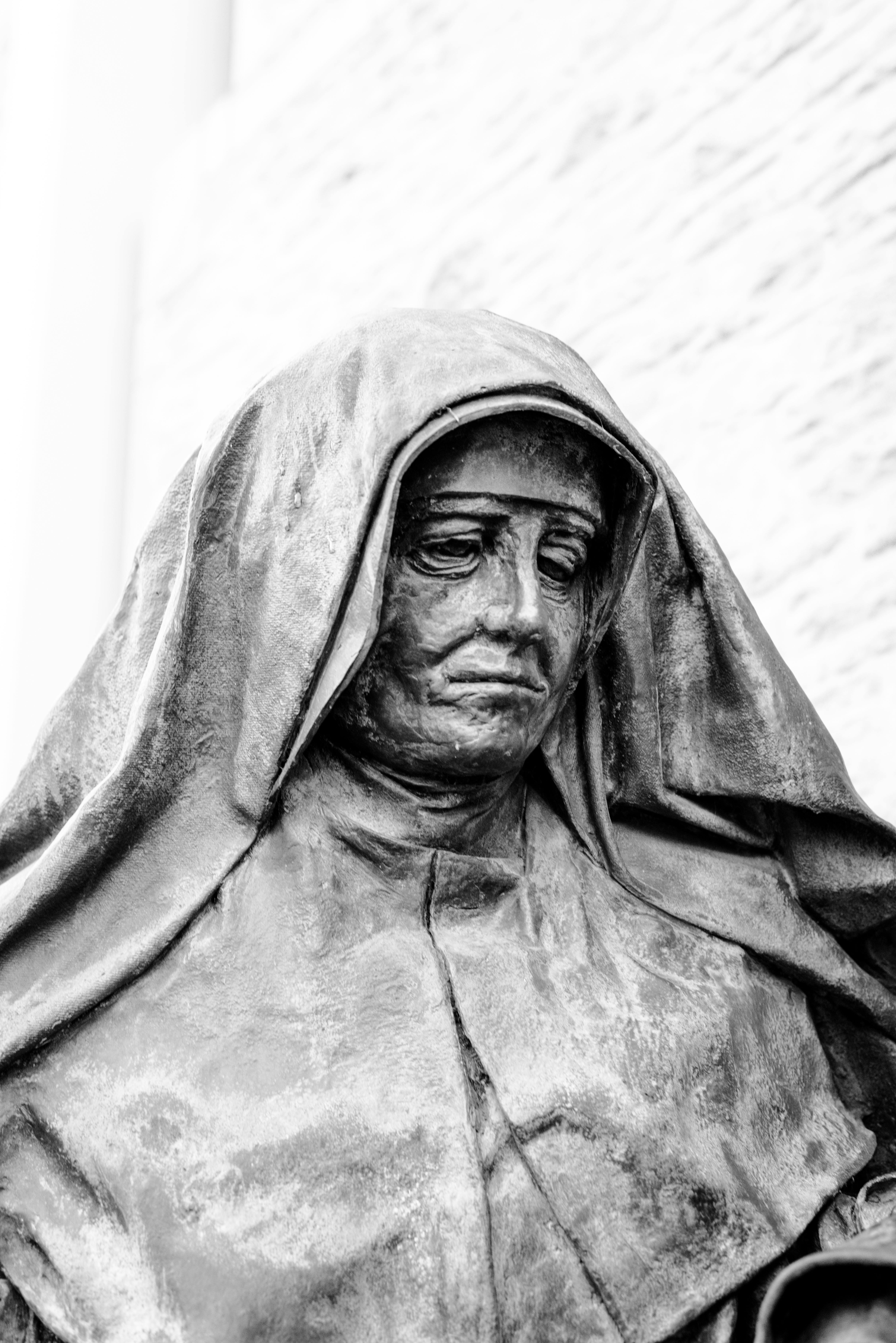 Black and White Statue of a Hooded Figure · Free Stock Photo