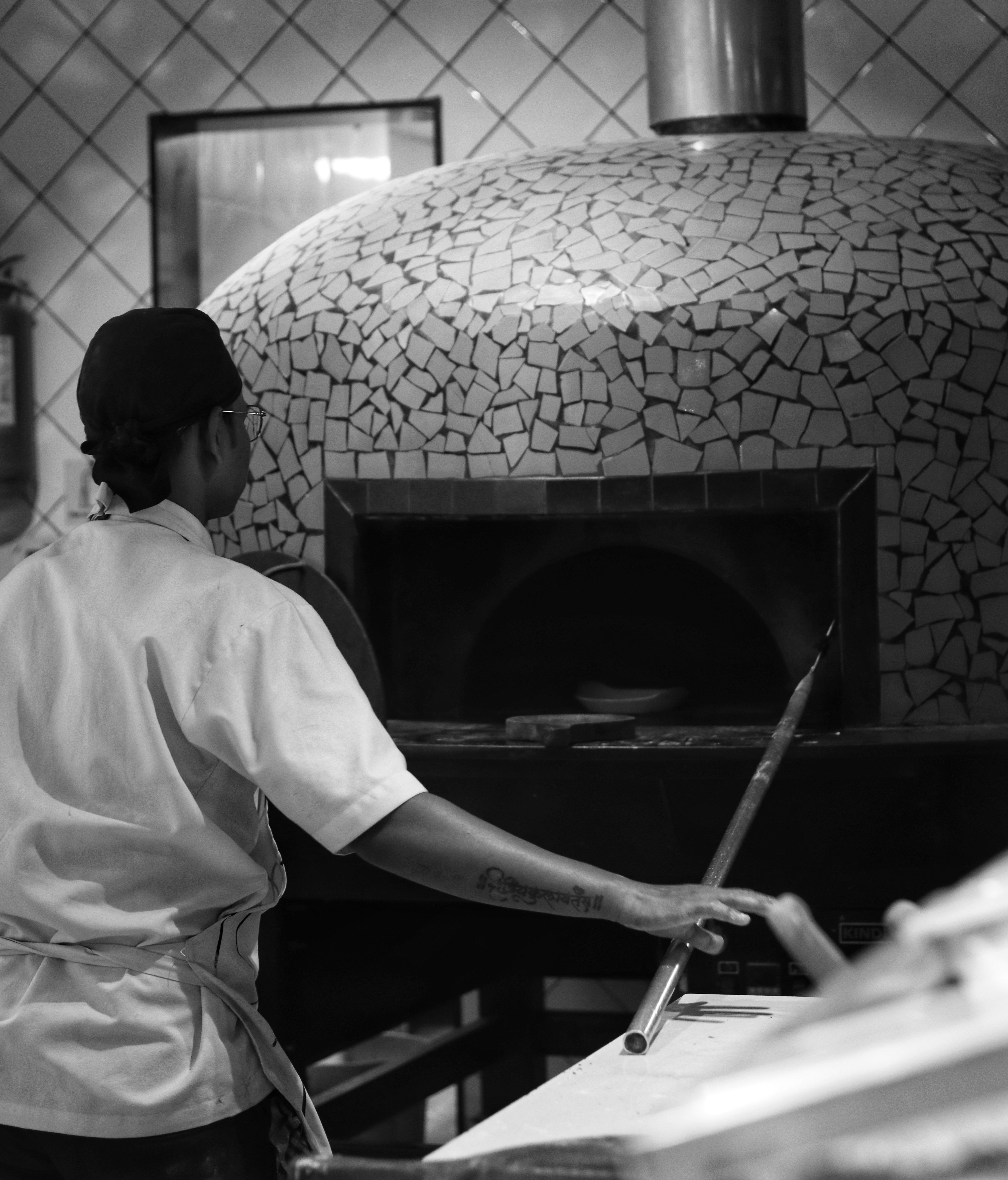 Chef Baking Pizza in Traditional Oven · Free Stock Photo