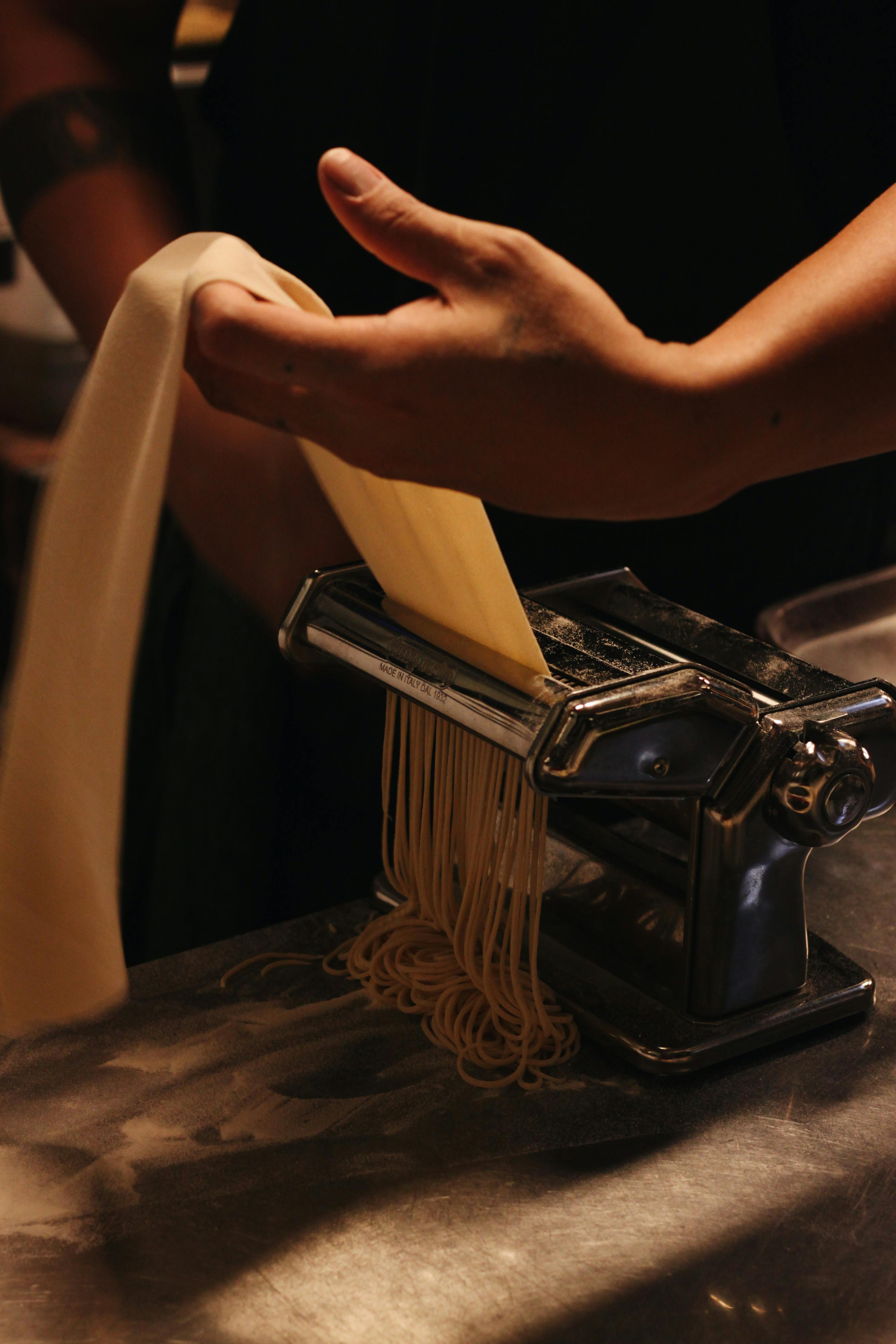 Person Making Pasta Tagliatelle · Free Stock Photo