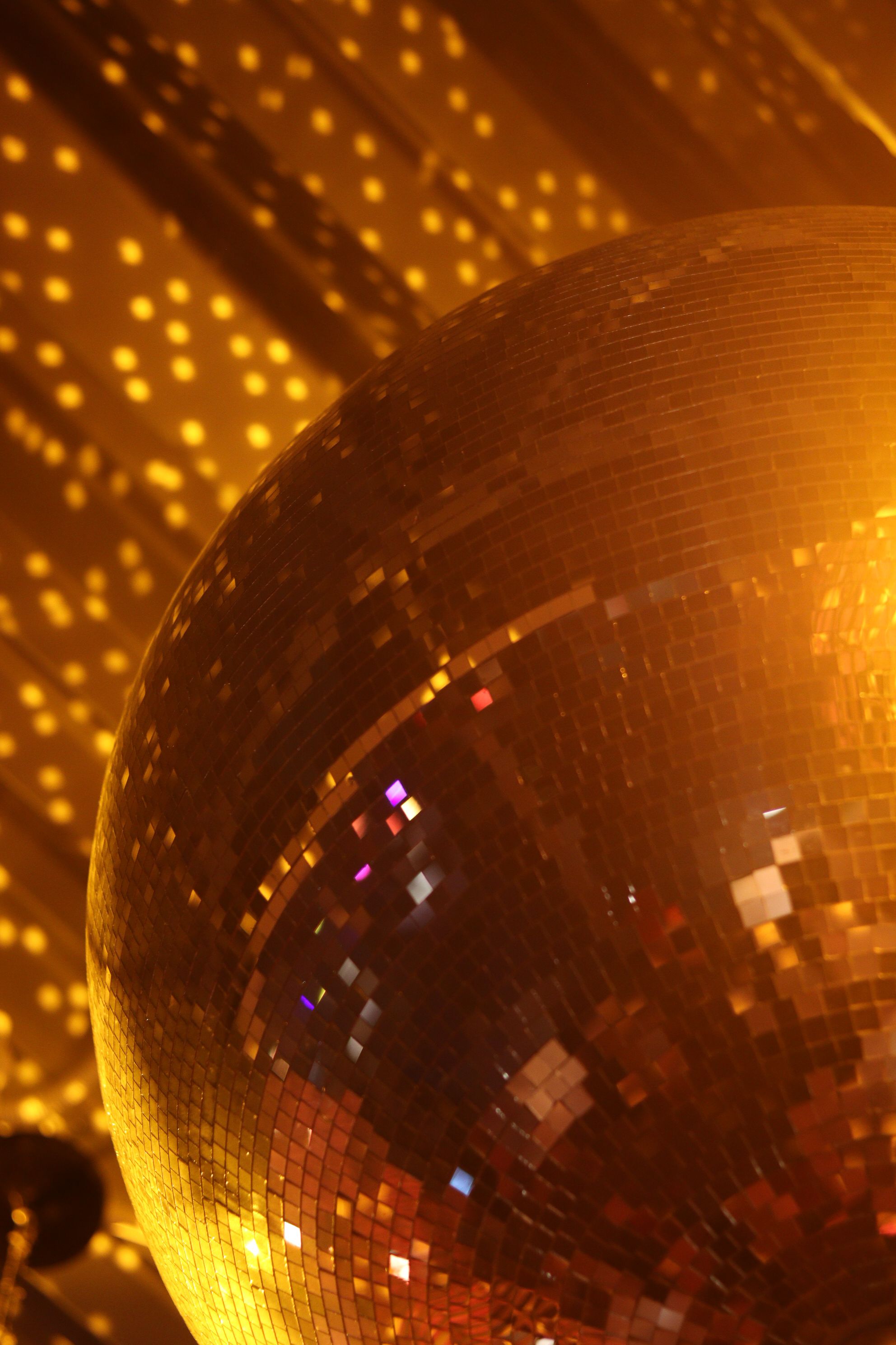 Glittering Disco Ball with Golden Reflections · Free Stock Photo