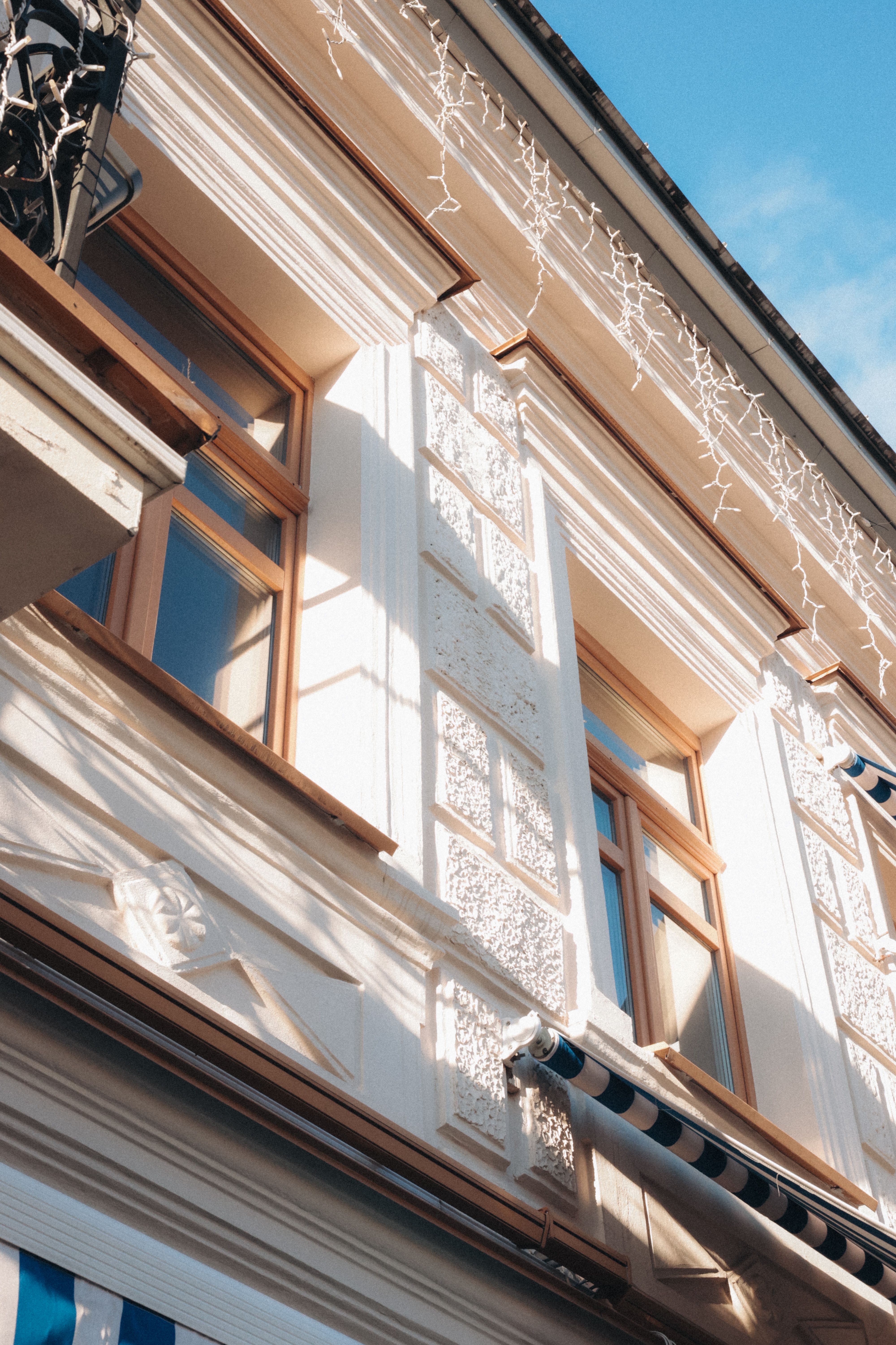 Elegant European Style Building Facade in Sunlight · Free Stock Photo
