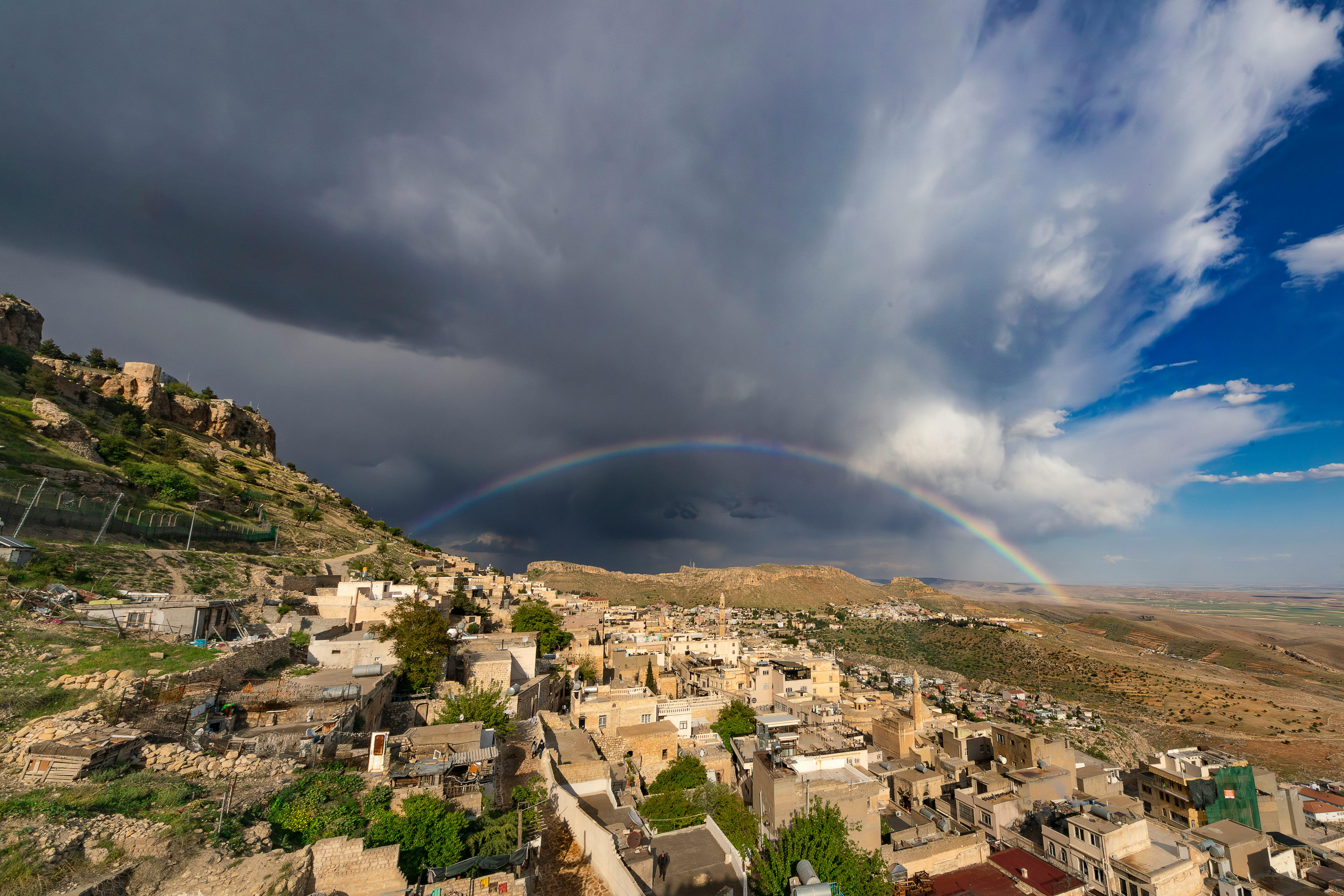 Dramatic Overhead Rainbow Above Historic Town · Free Stock Photo