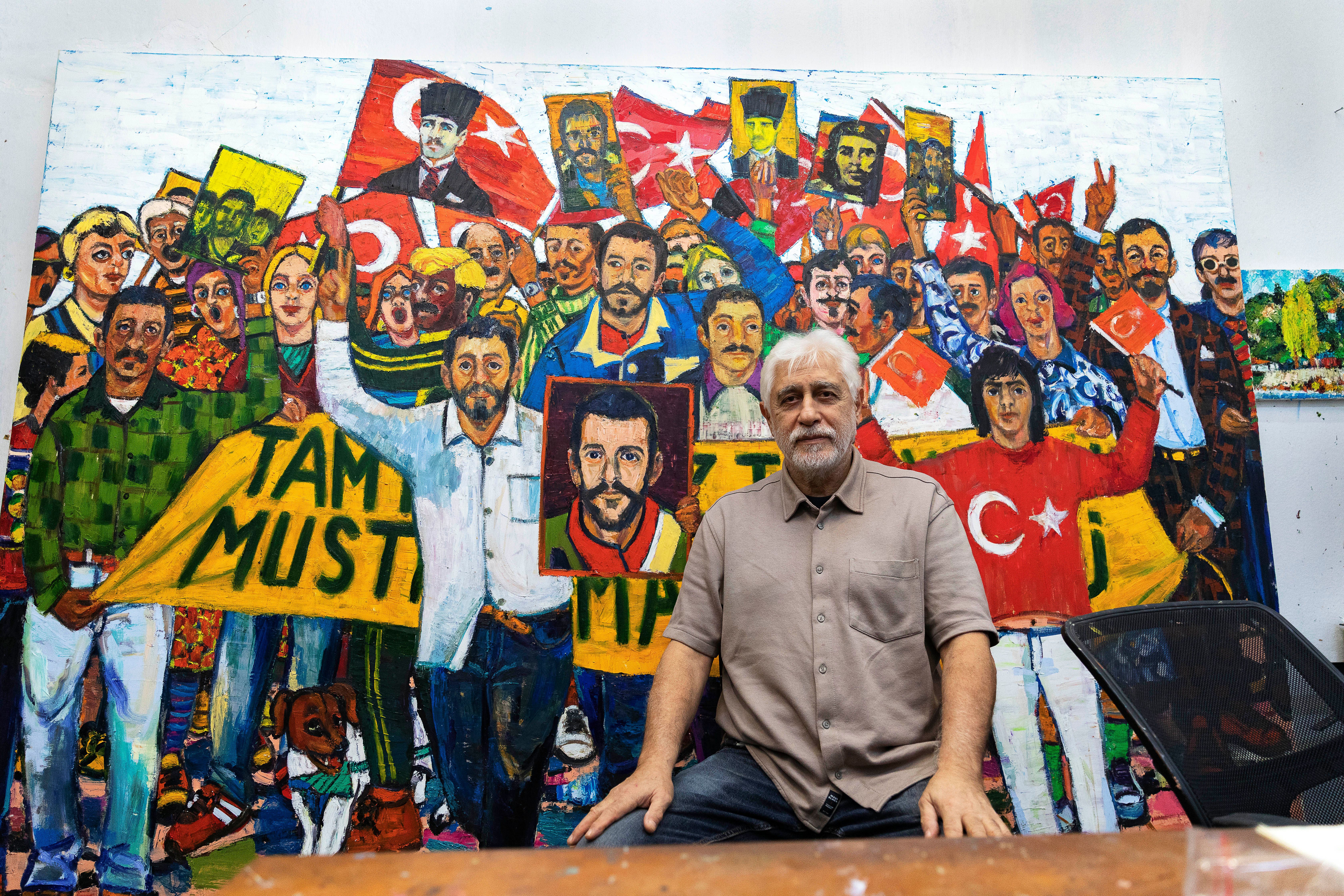 Artist with Colorful Political Mural · Free Stock Photo