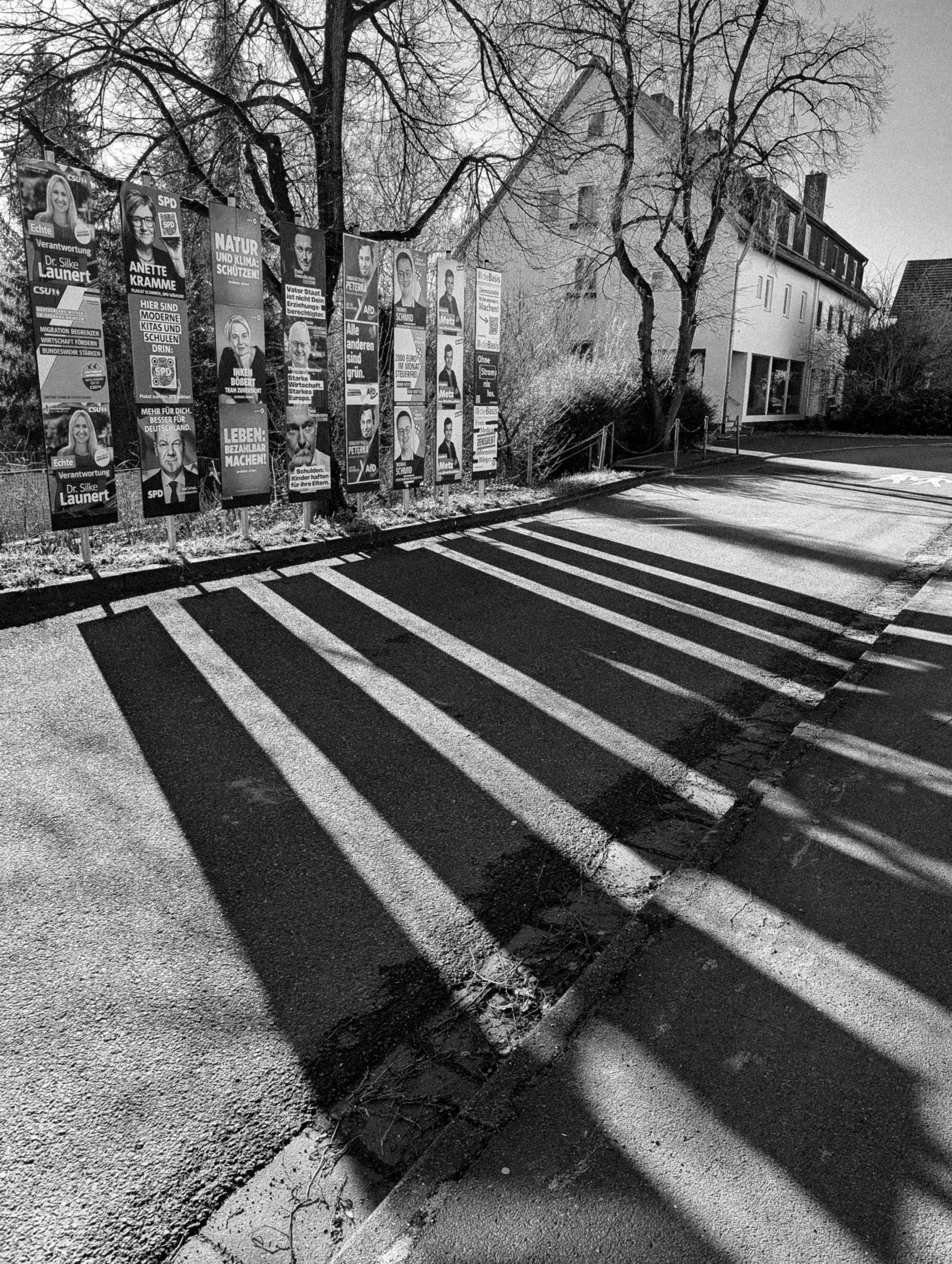 Shadows Cast by Election Posters on Street · Free Stock Photo
