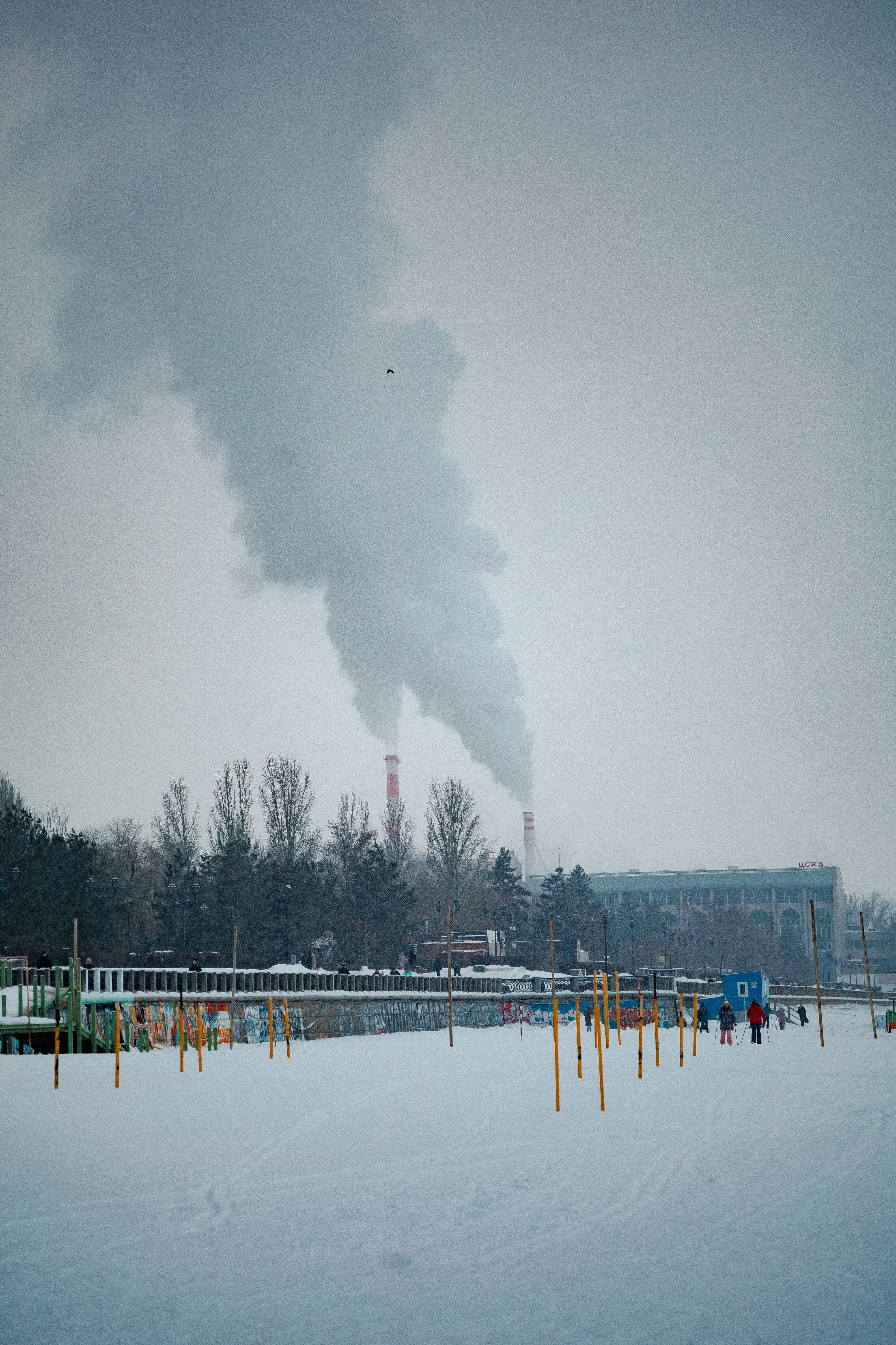 Industrial Smoke Stacks in Snowy Winter Scene · Free Stock Photo