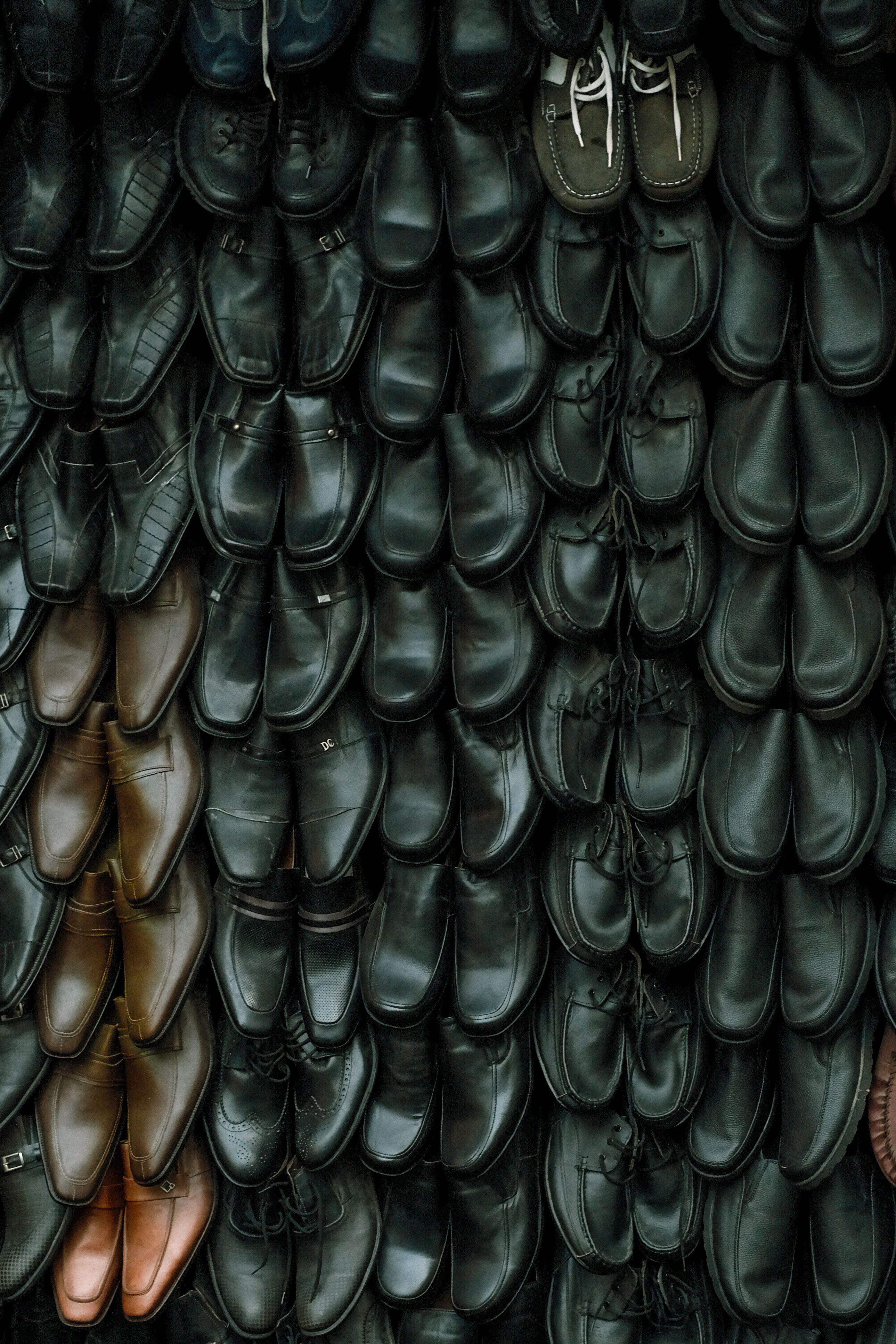 Diverse Leather Shoes Display in Market · Free Stock Photo