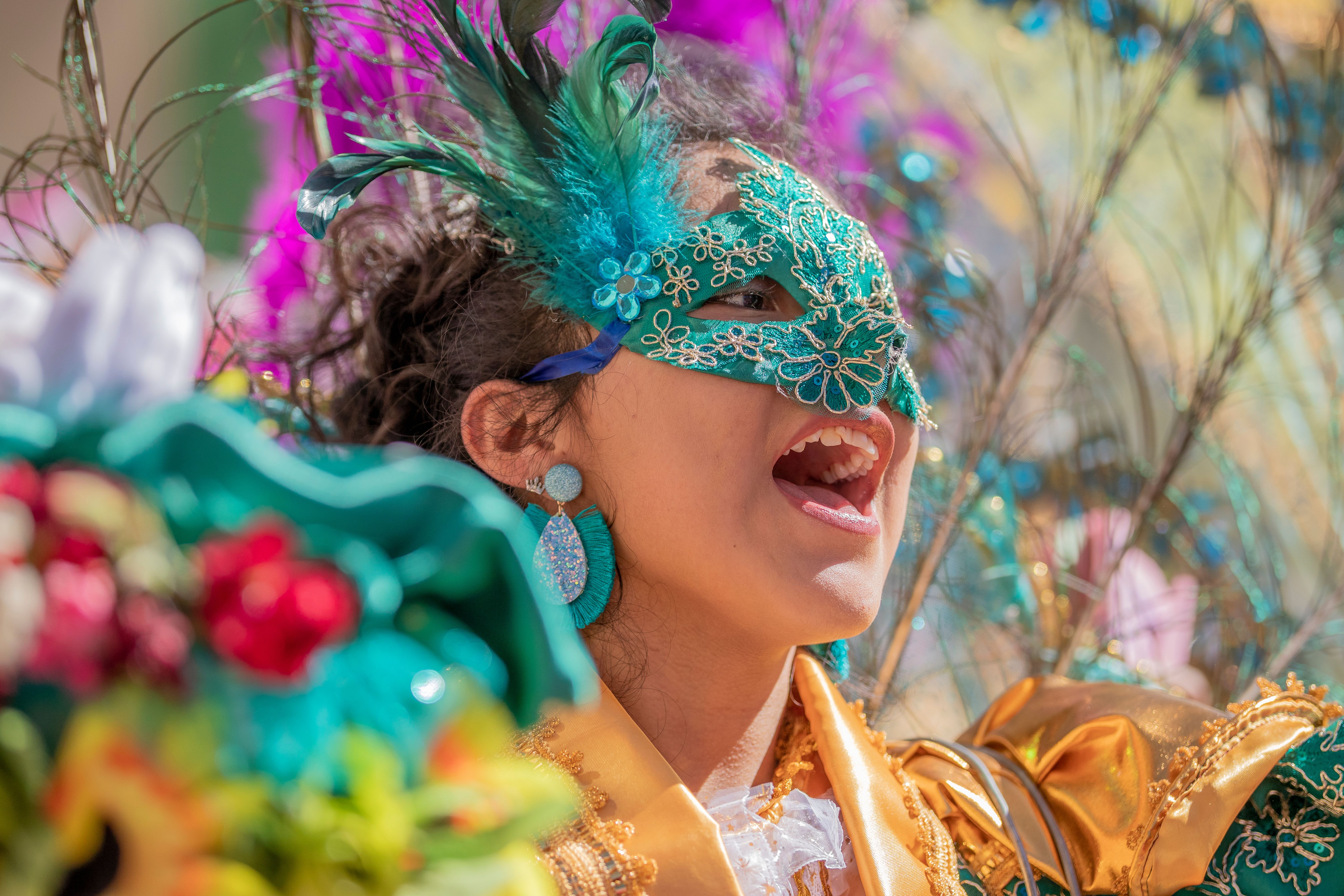 Vibrant Carnival Celebration with Feathered Mask · Free Stock Photo