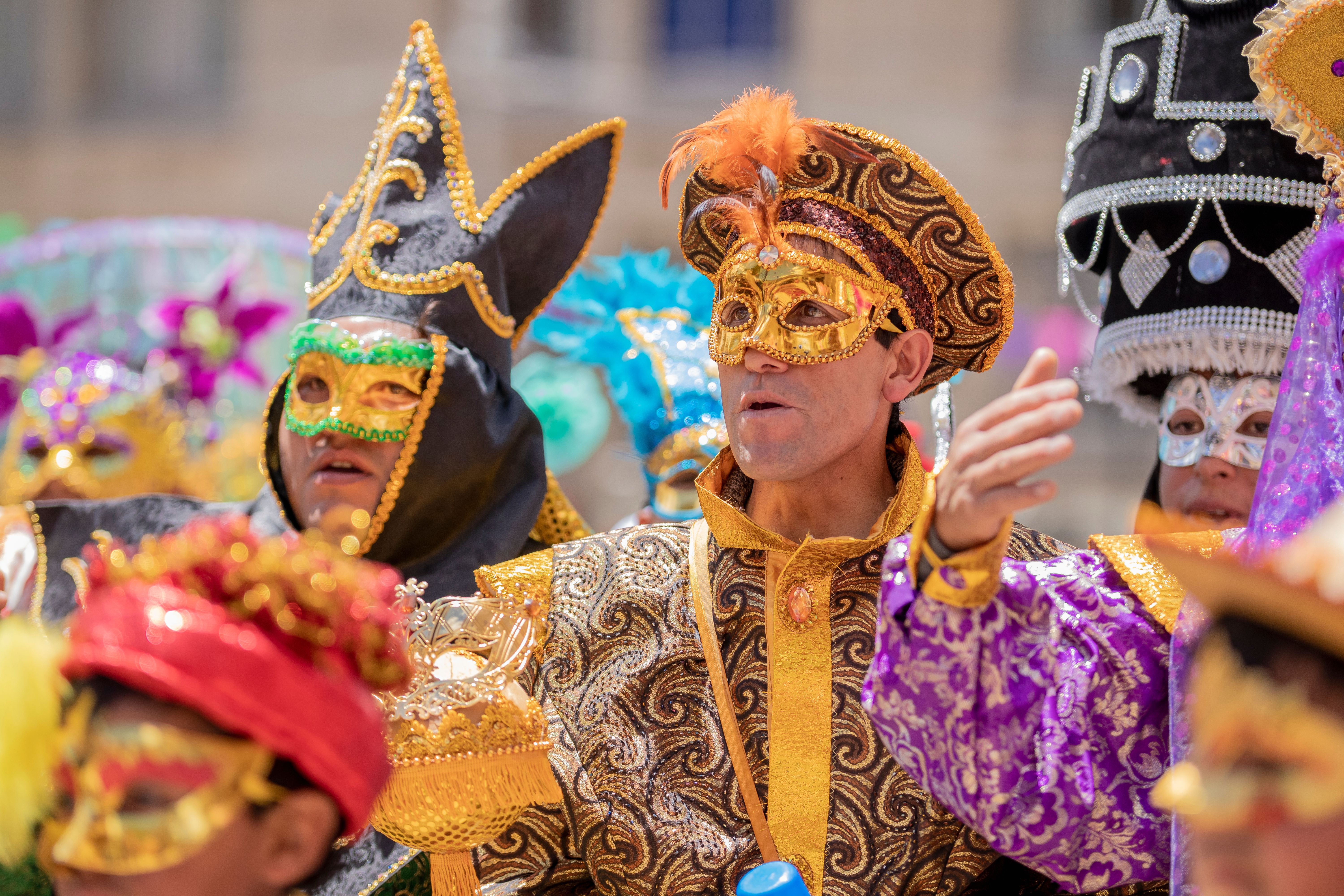 Vibrant Carnival Masks and Costumes Celebration · Free Stock Photo