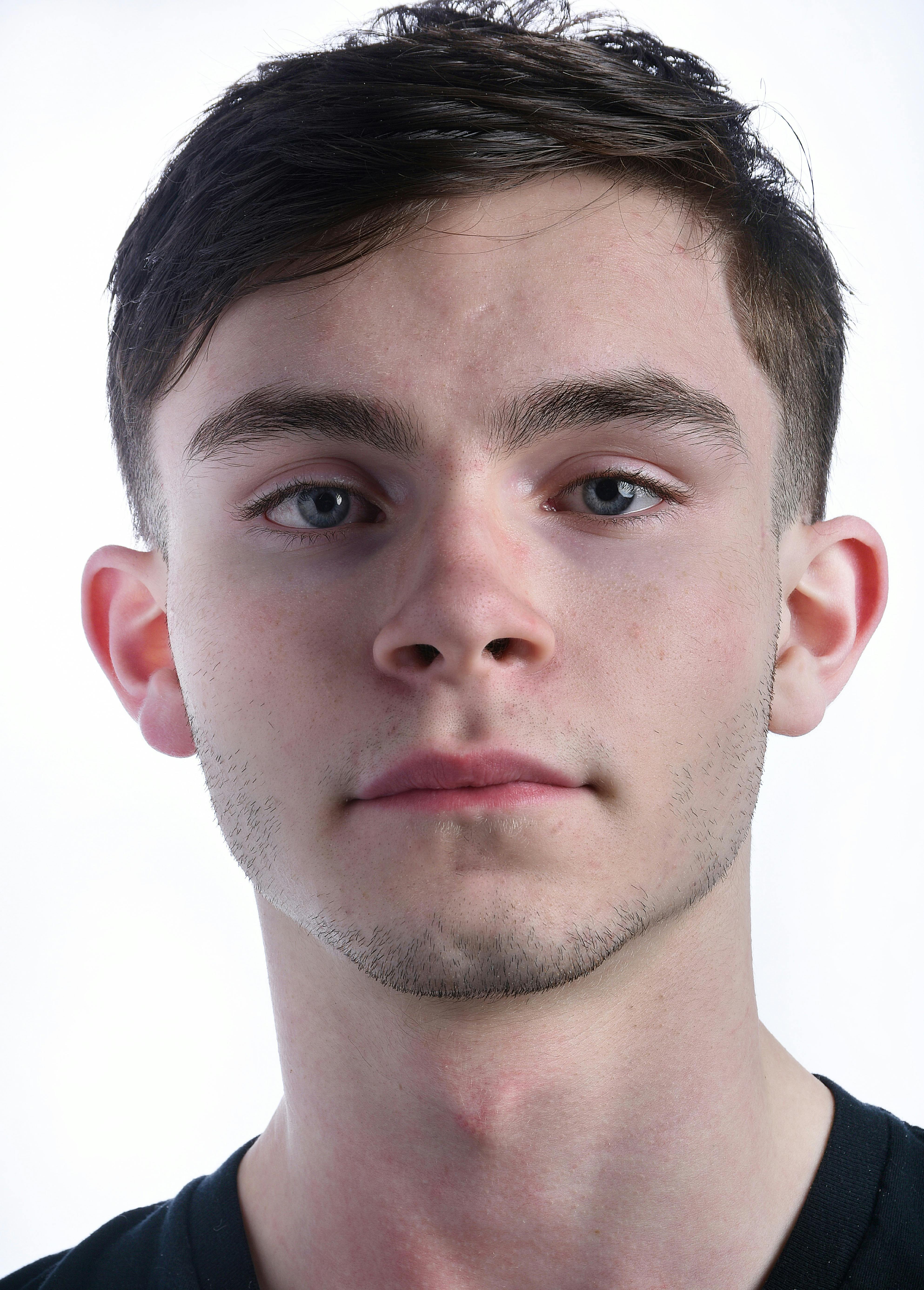 Young Man's Portrait with Neutral Expression · Free Stock Photo