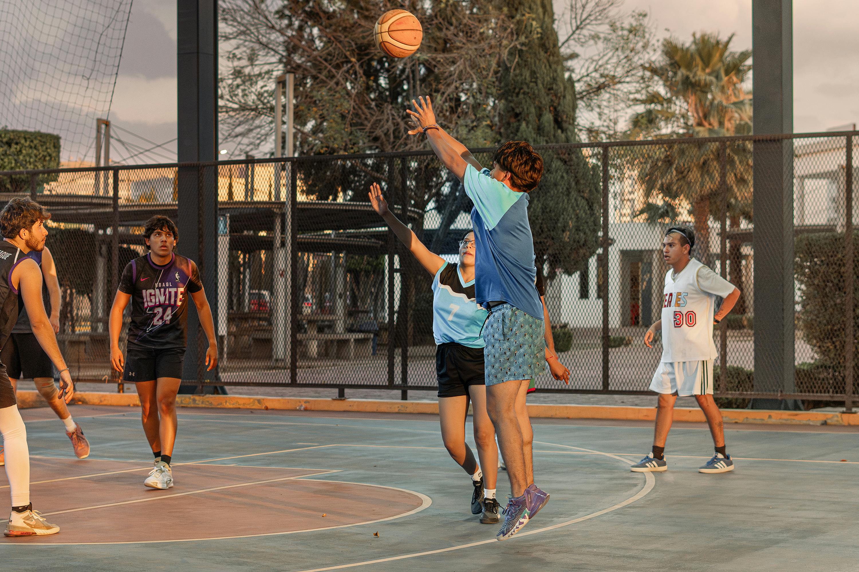Diverse Teams Playing Intense Outdoor Basketball · Free Stock Photo
