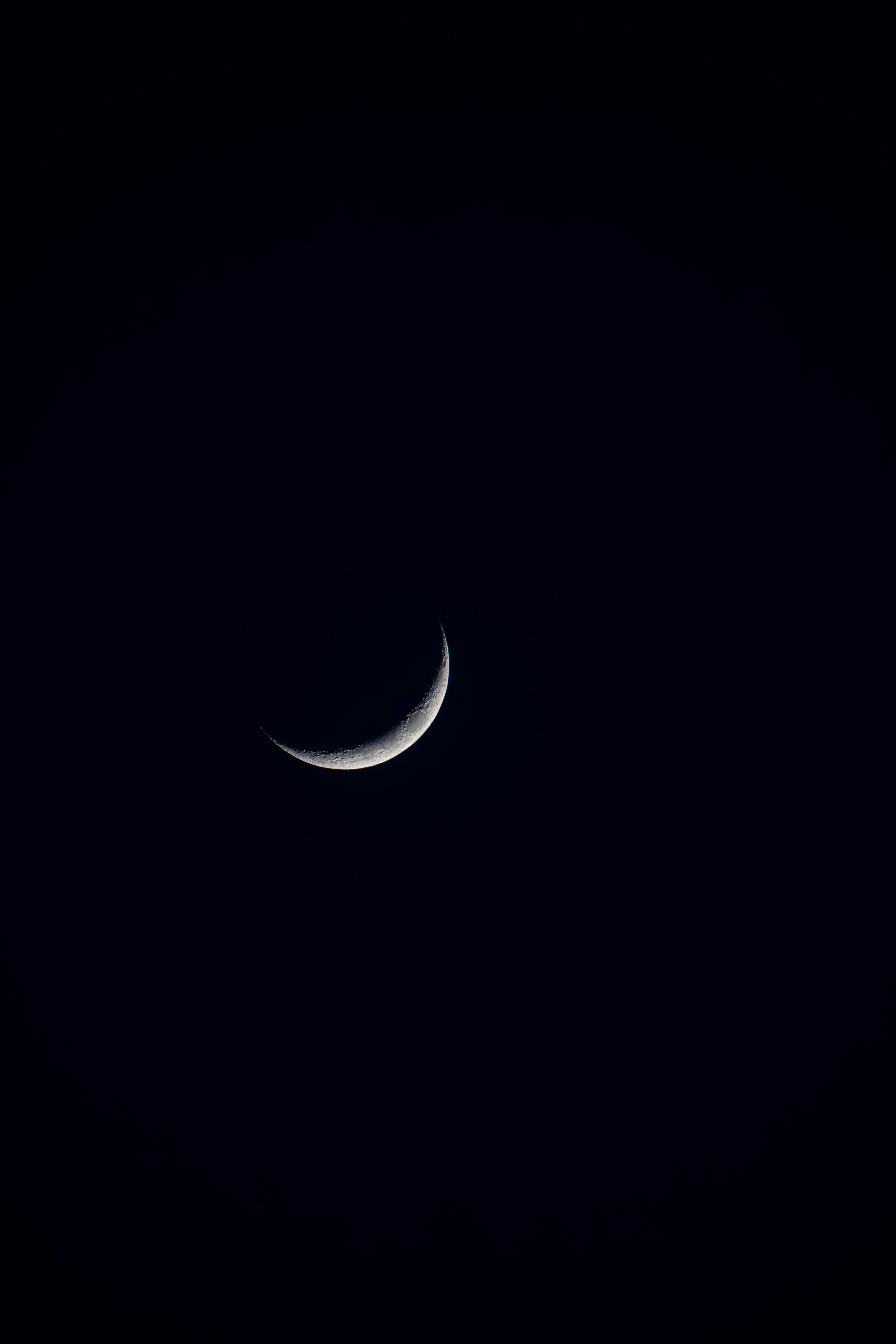 Crescent Moon against a Dark Night Sky · Free Stock Photo