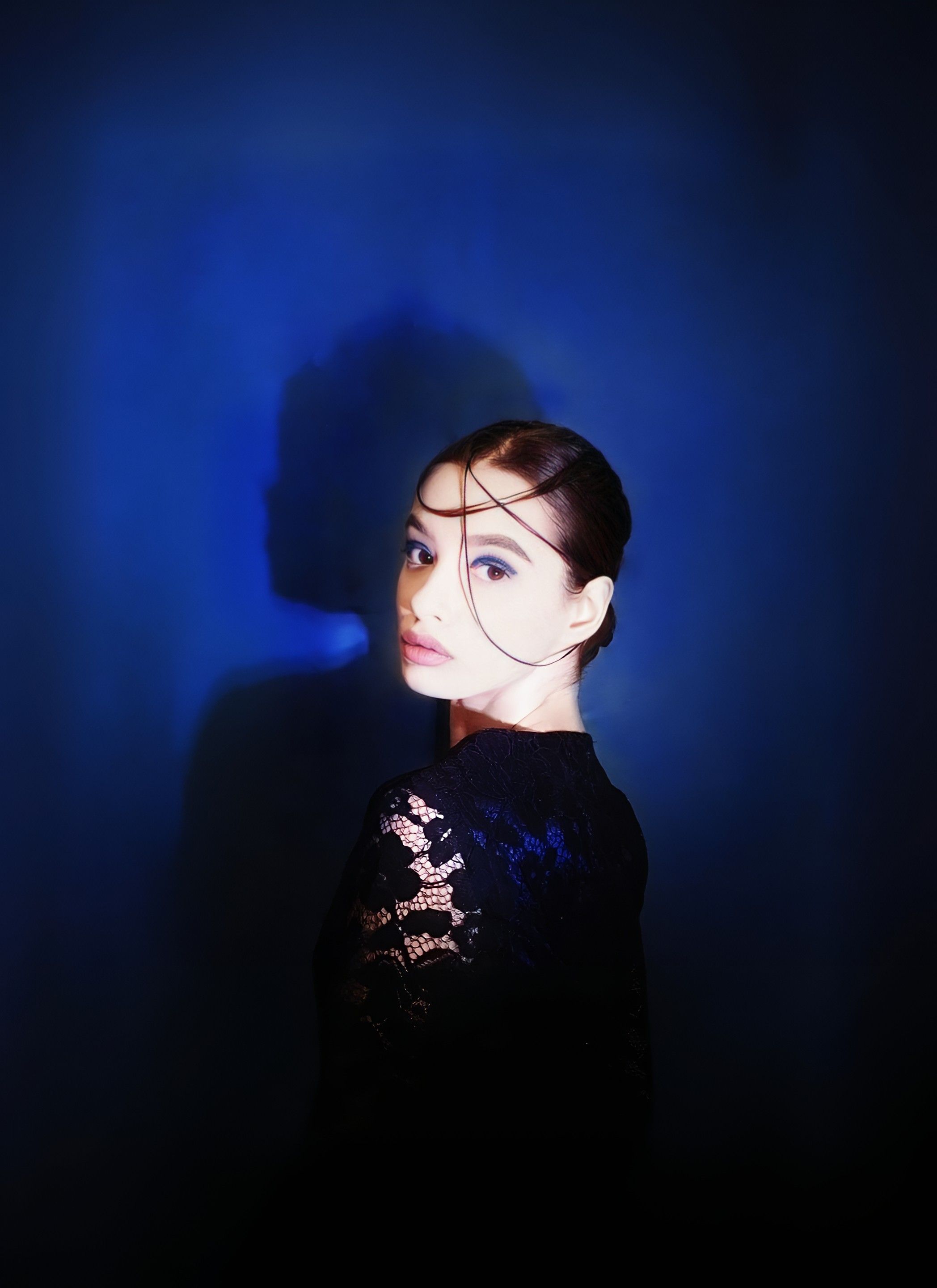 Dramatic Portrait of a Woman with Shadows · Free Stock Photo
