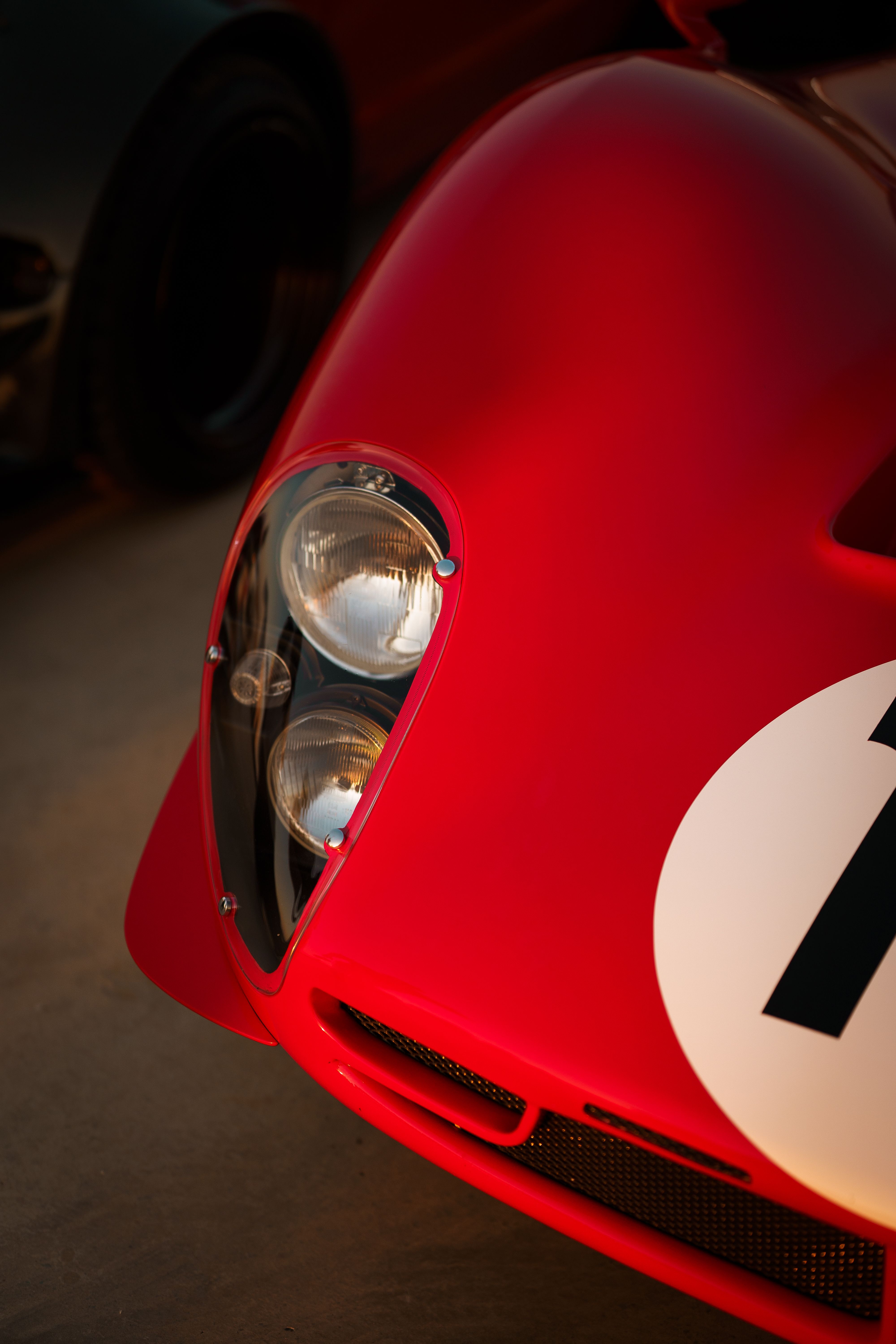 Close-up of Classic Red Race Car Headlight · Free Stock Photo