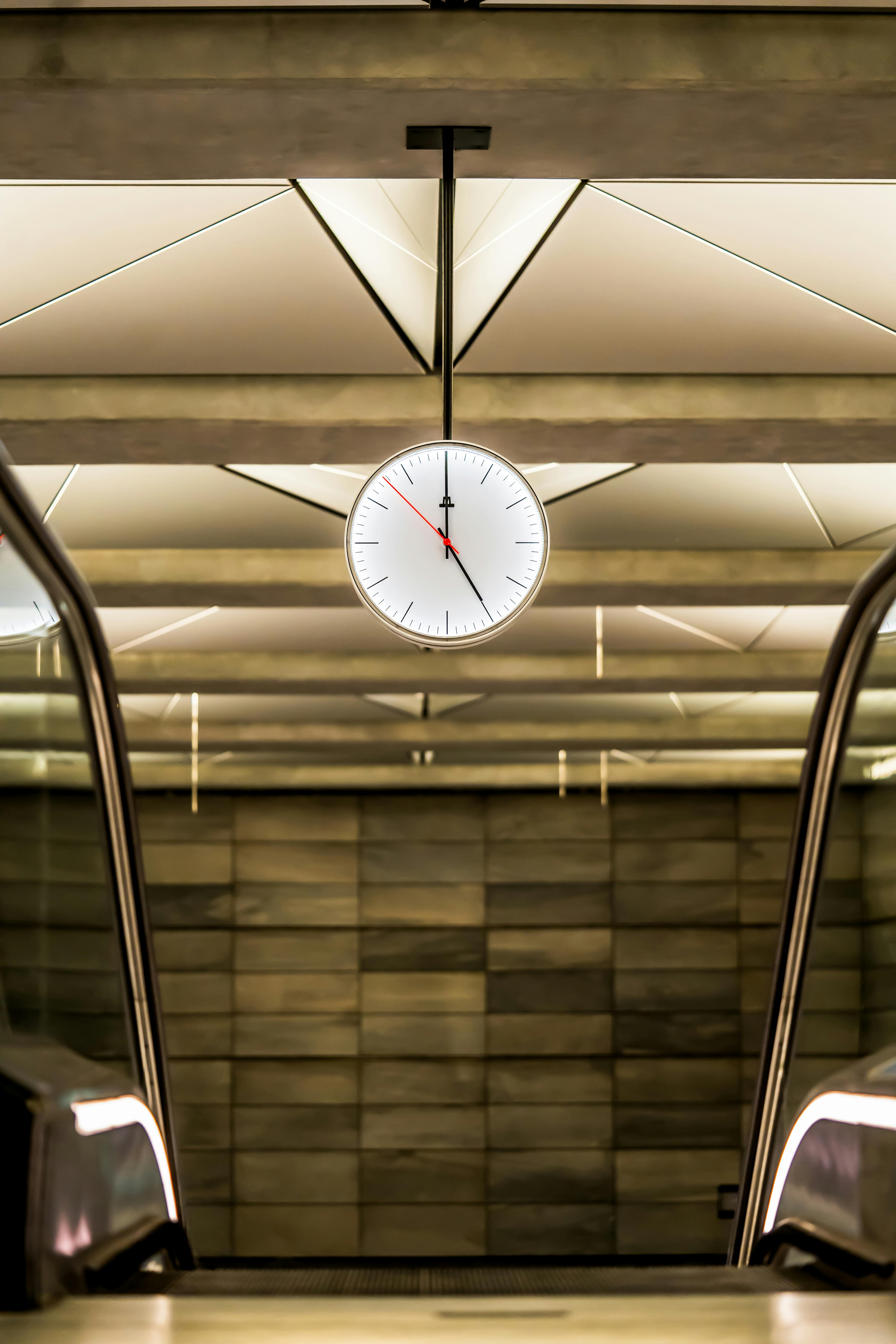 Modern Subway Clock with Escalator View · Free Stock Photo