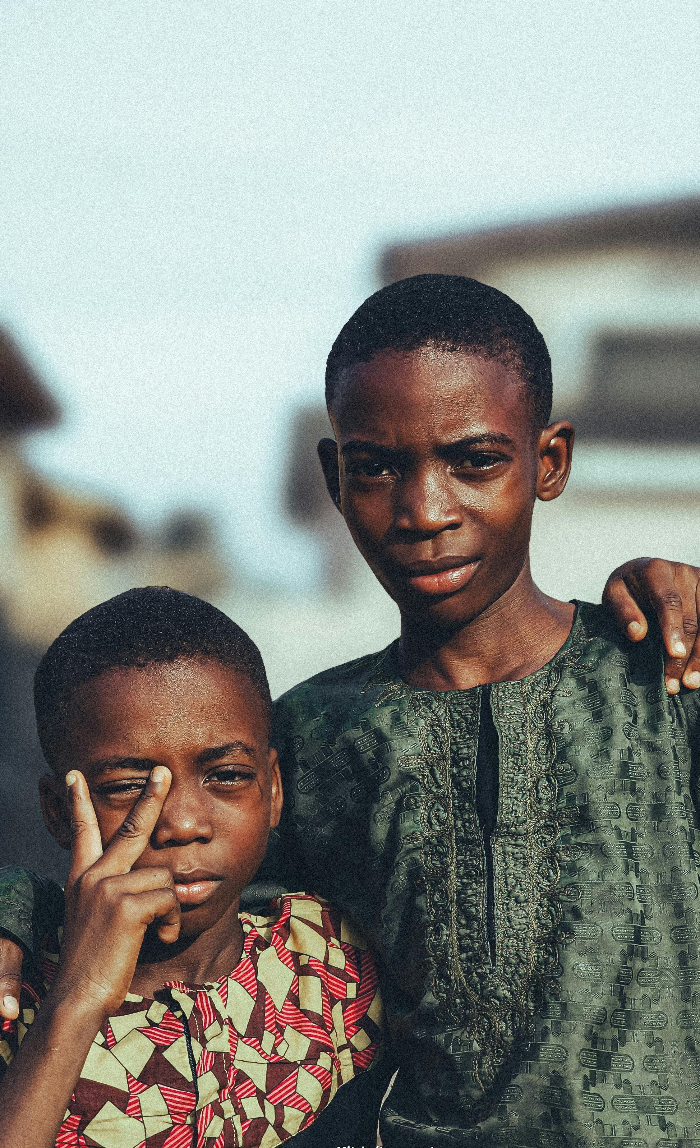 Portrait of Two African Boys in Traditional Attire · Free Stock Photo