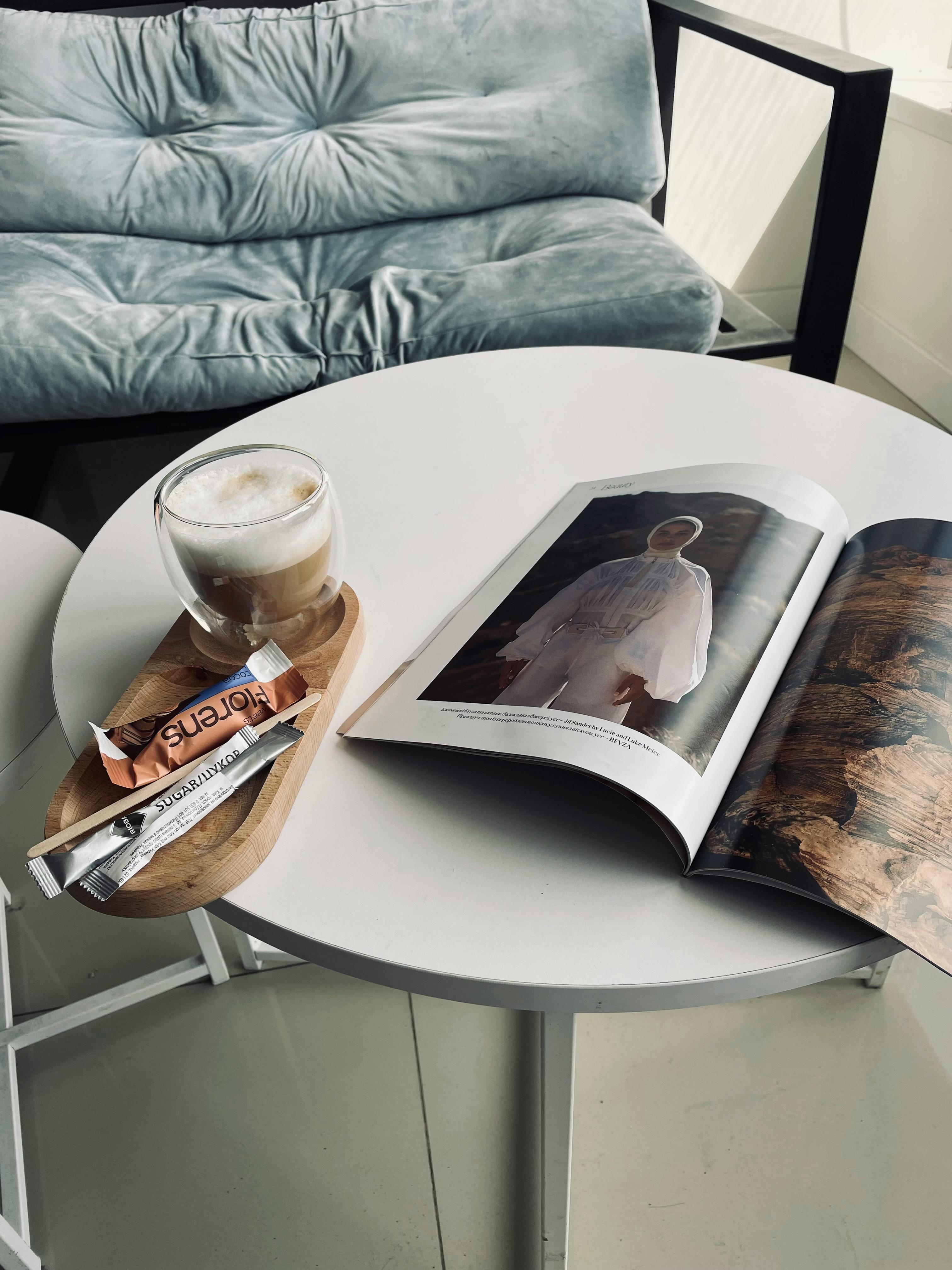 Cozy Coffee Table Setting with Magazine · Free Stock Photo