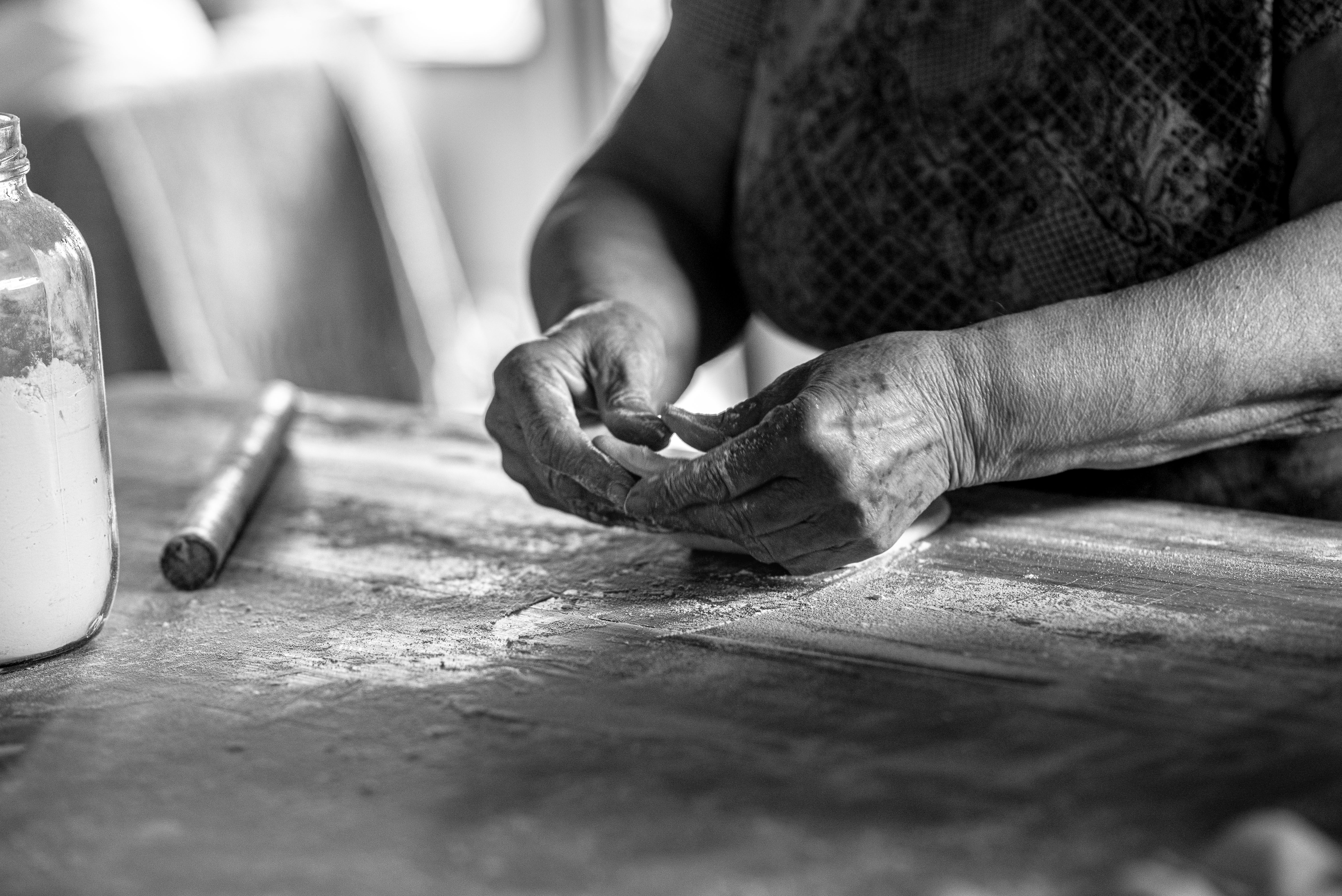 Black and White Hands Kneading Dough · Free Stock Photo