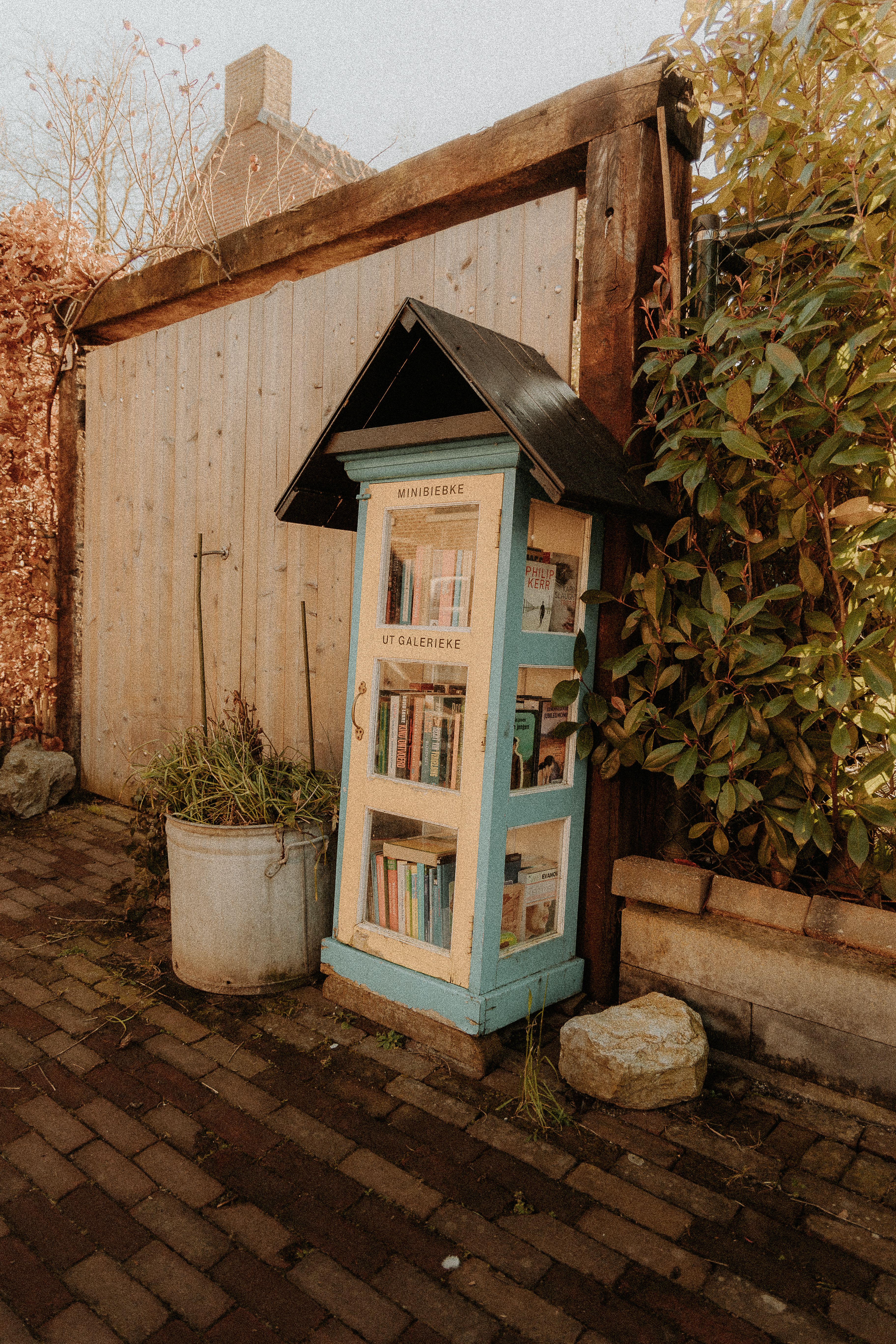 Charming Outdoor Book Cabinet in Countryside Setting · Free Stock Photo