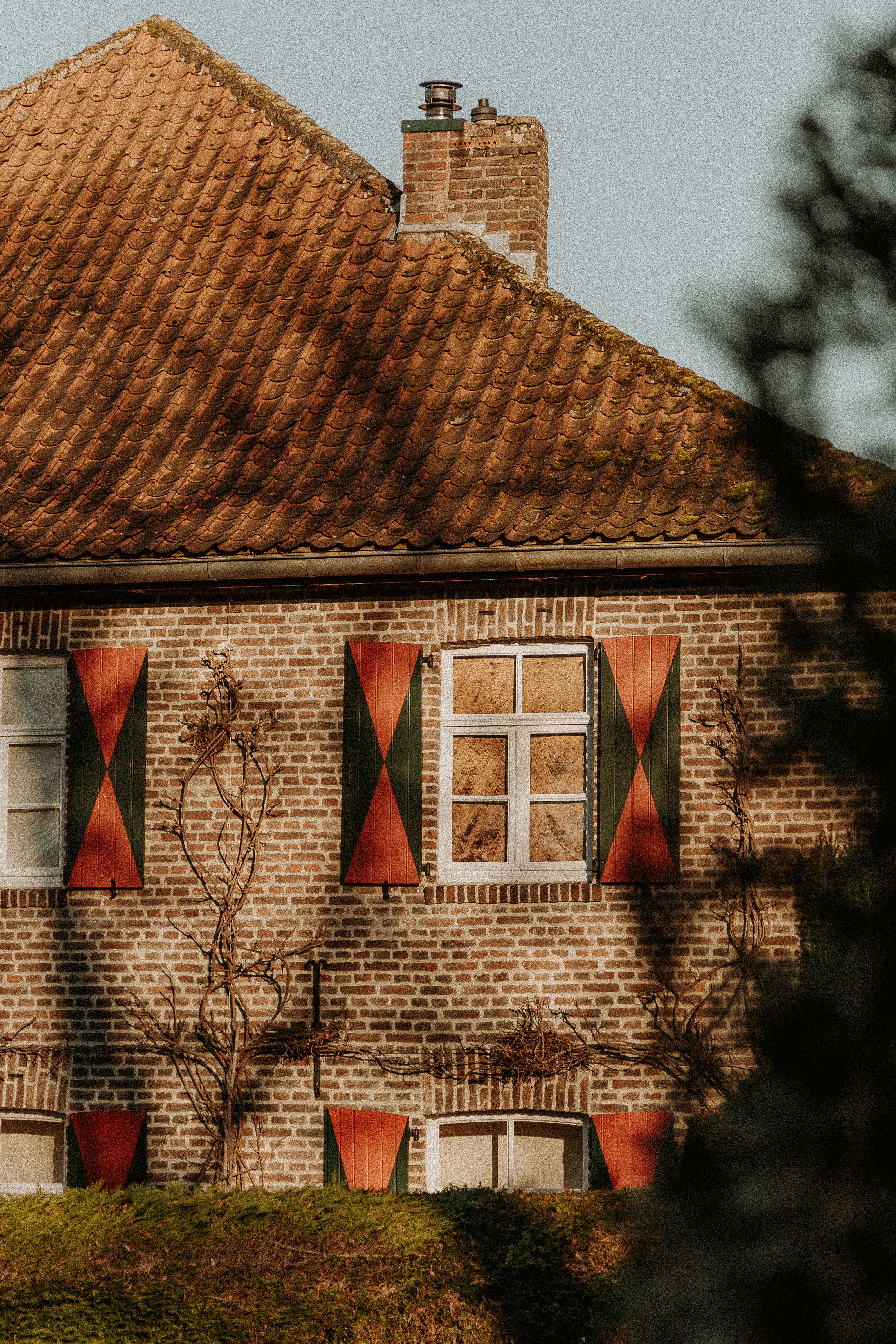 Charming Brick Cottage with Colorful Shutters · Free Stock Photo
