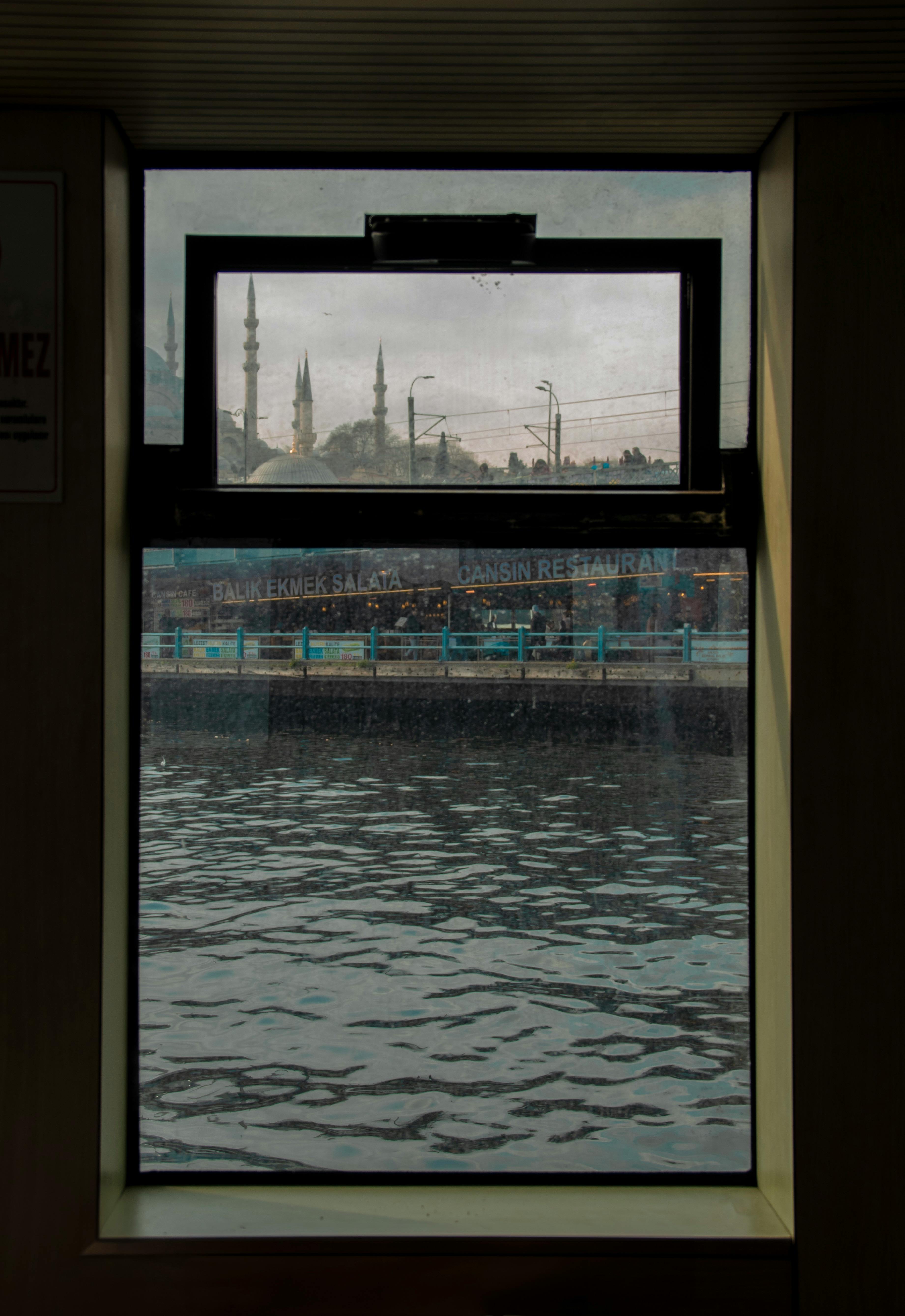Scenic View of Mosque from Waterfront Window · Free Stock Photo