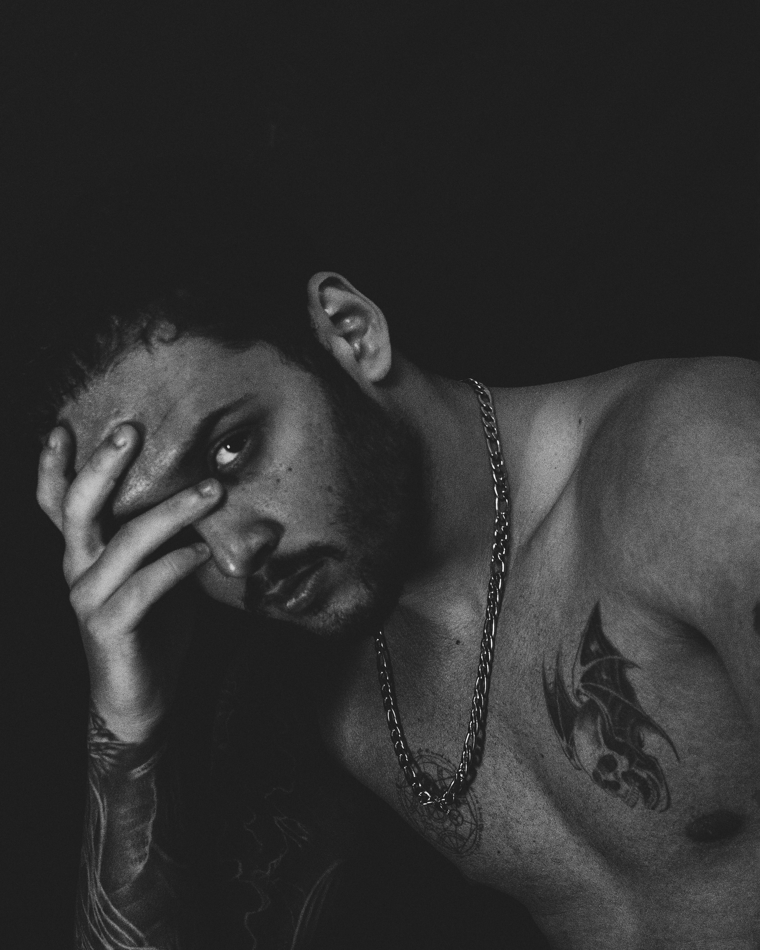 Moody Black and White Portrait of Tattooed Man · Free Stock Photo